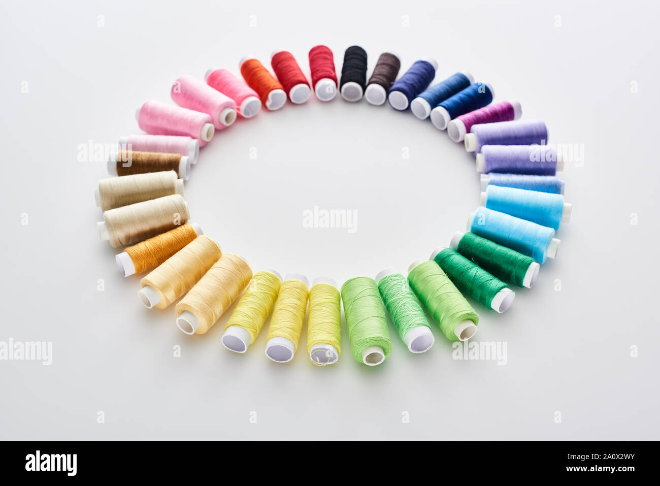 flat lay with bright and colorful threads on white background Stock ...