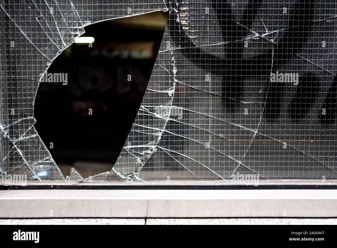 A smashed window in the centre of Paris Stock Photo - Alamy