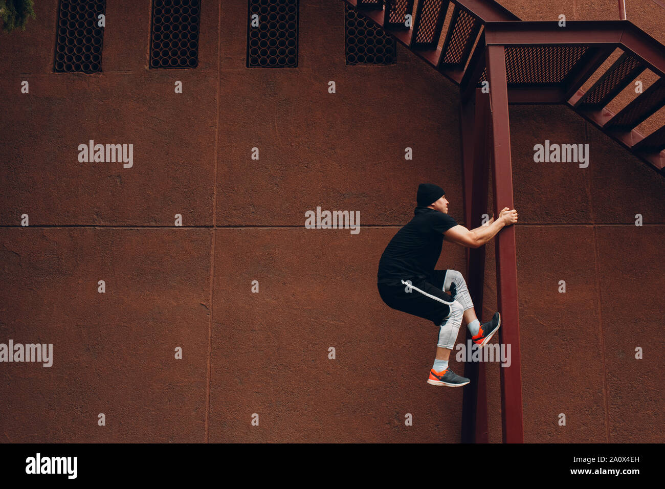 Parkour young man making acrobatic trick and flip jumping high Stock ...
