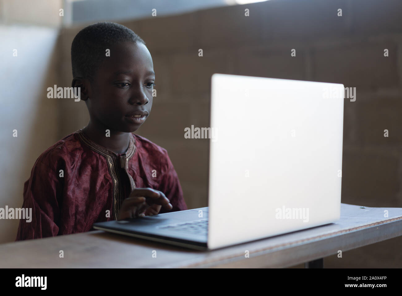 Technology for Future Africa, Black Boy Learning with Laptop Stock ...