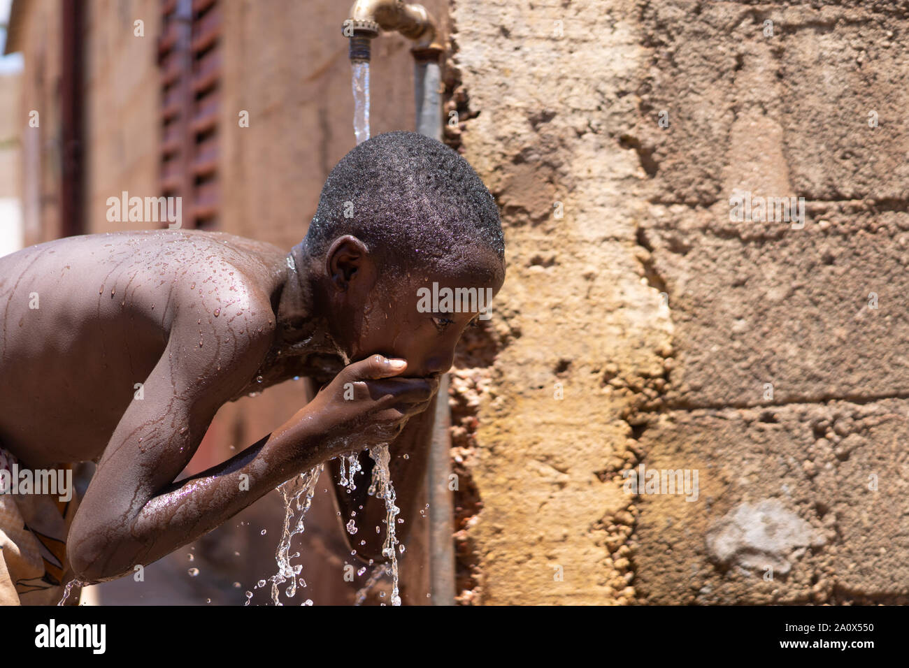 Health and Hygiene symbol, African boy with water and soap Stock Photo ...