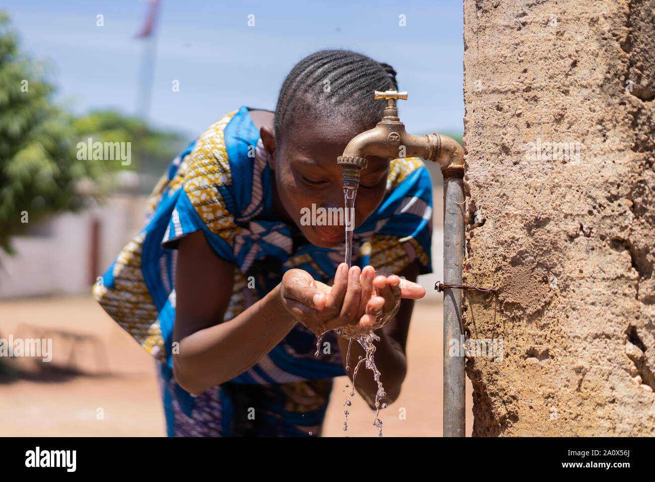 Tasting Fresh Water, African Black Child Enjoys Freshwater Stock Photo ...