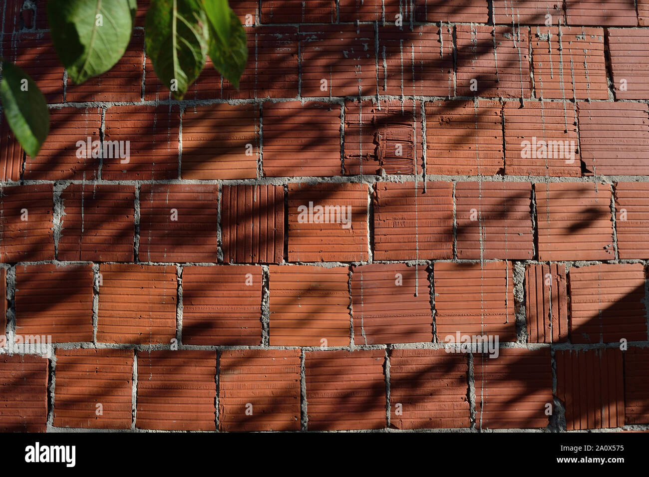 Clay block wall background Stock Photo - Alamy
