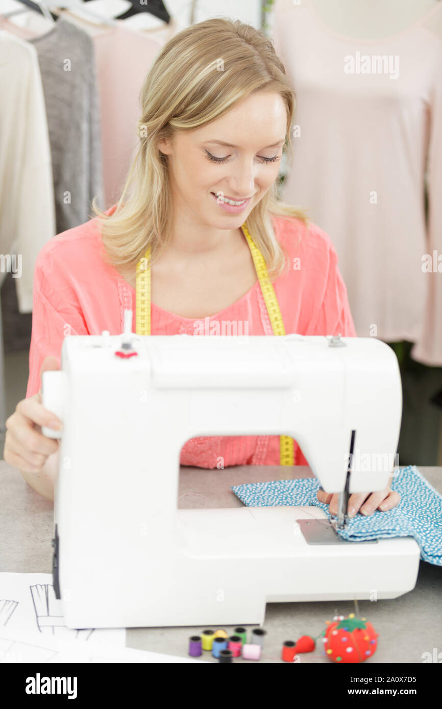 young tailor using a modern sewing machine Stock Photo - Alamy