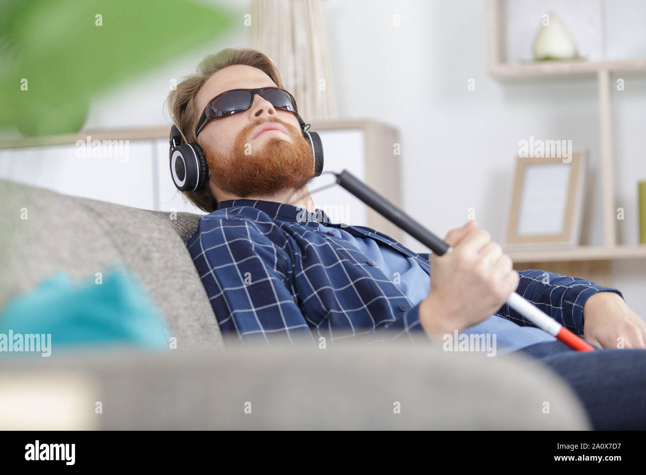 a blind man at home Stock Photo - Alamy