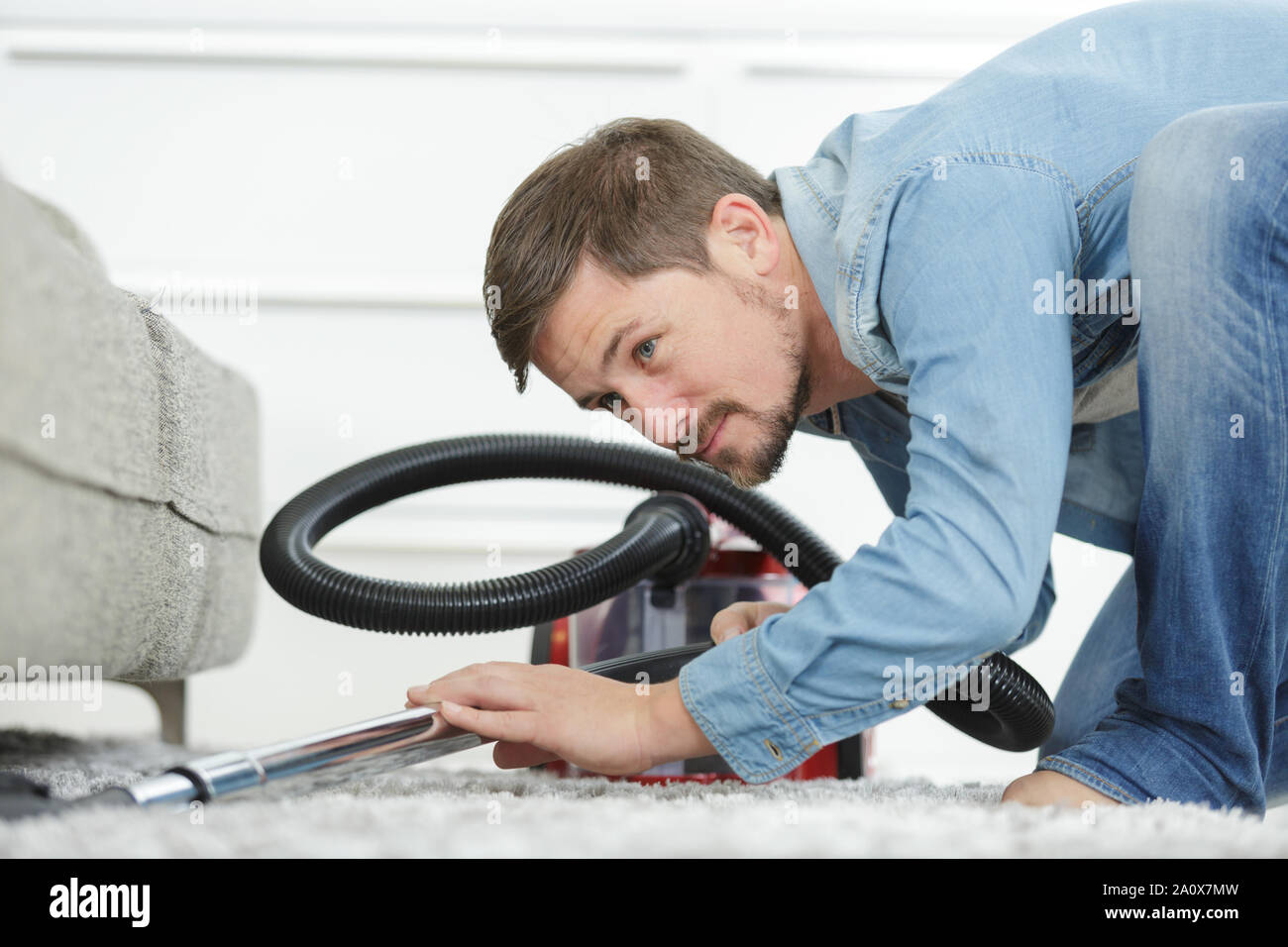 Man vacuum bed hi-res stock photography and images - Alamy