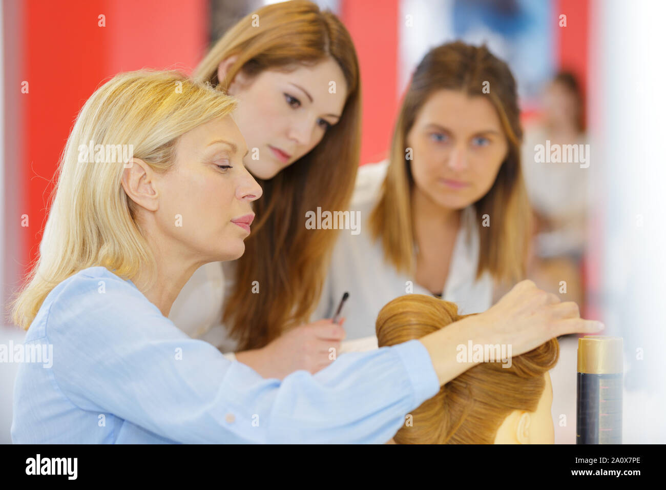 professional hairstylist showing hair designs Stock Photo - Alamy