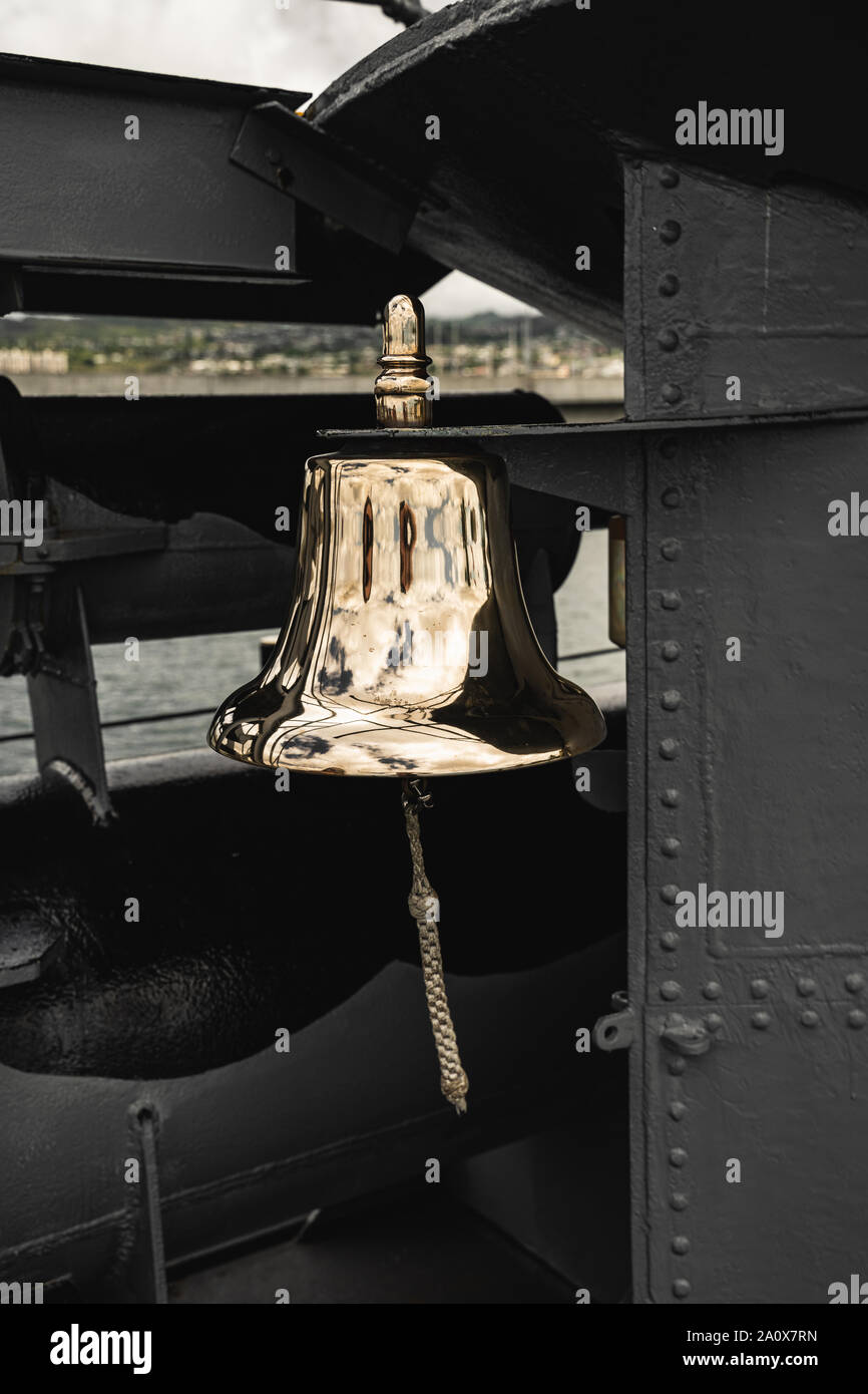 Pearl Harbor, Hawaii - August 23rd 2019: Shiny gold bell, detail shot ...