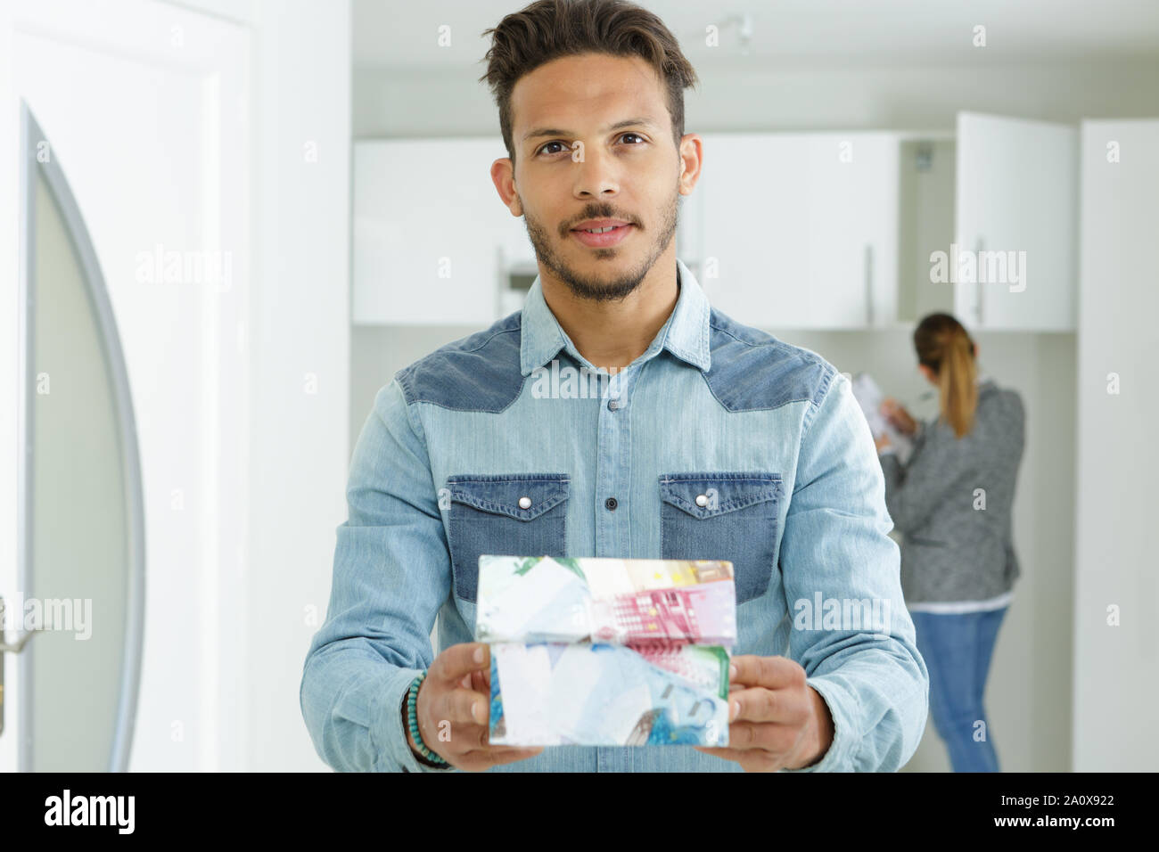 man building your house concept Stock Photo - Alamy