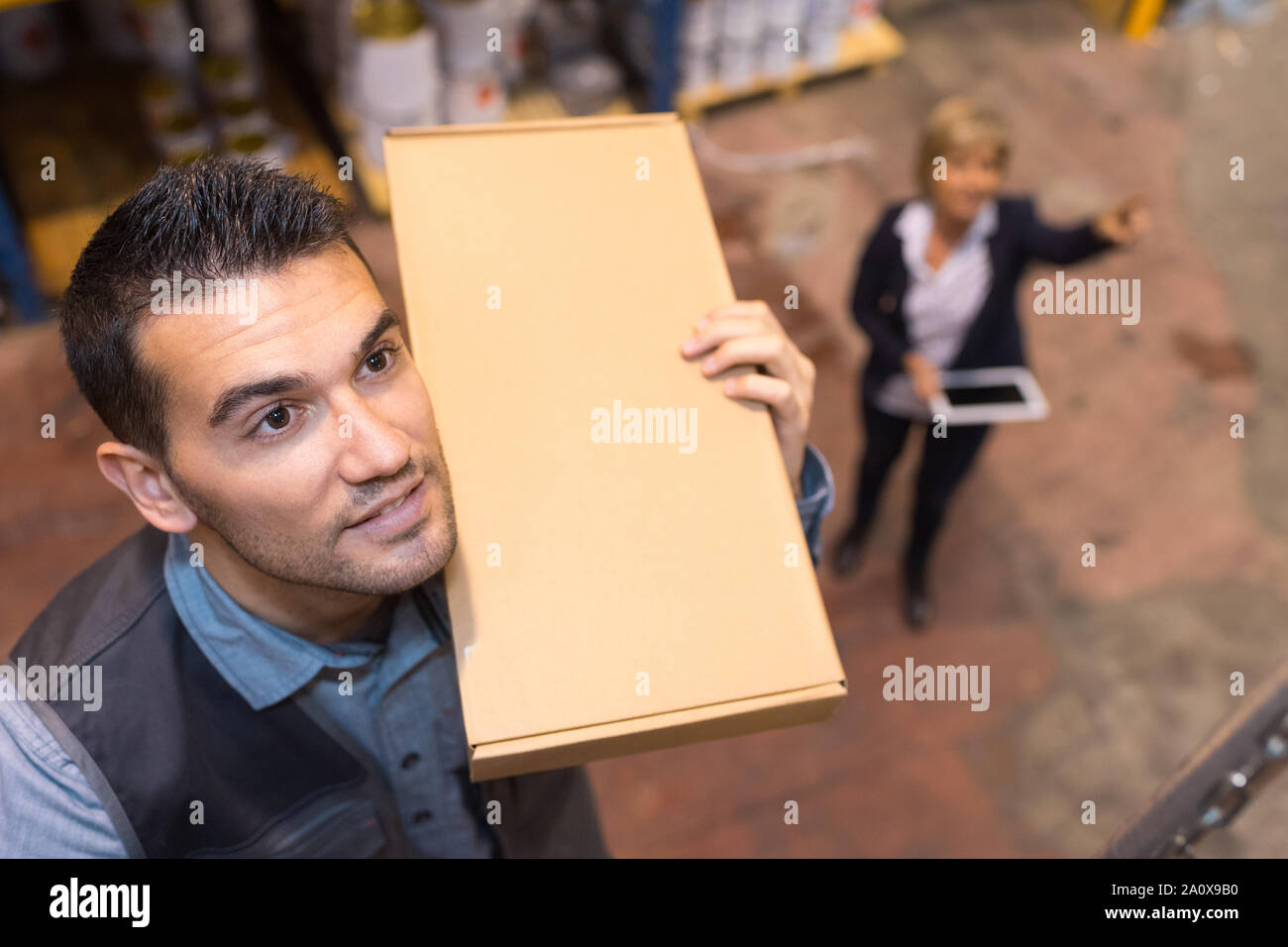 carpenter selecting wood in a hardware store Stock Photo - Alamy