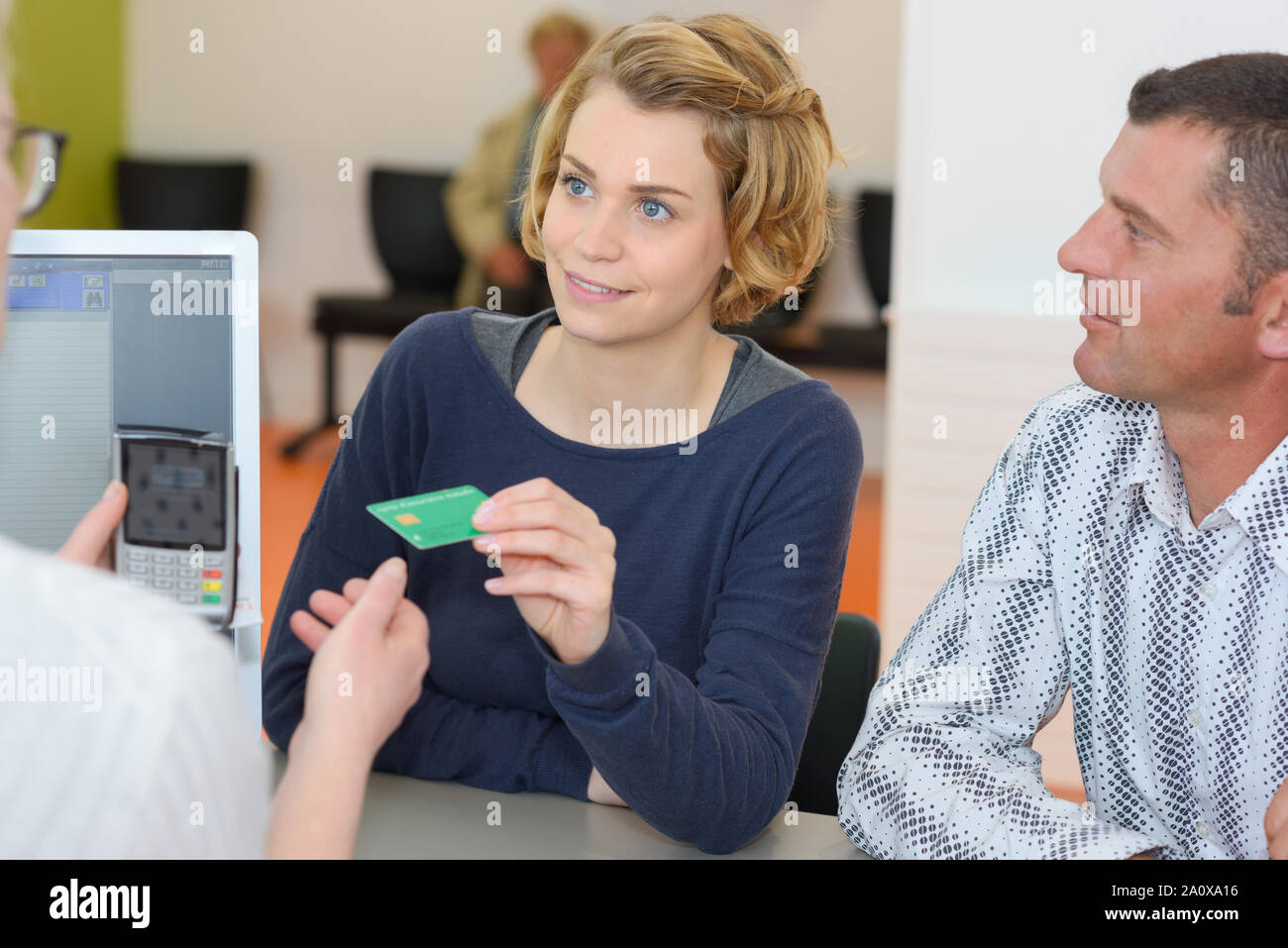 Woman showing medical insurance card hi-res stock photography and ...