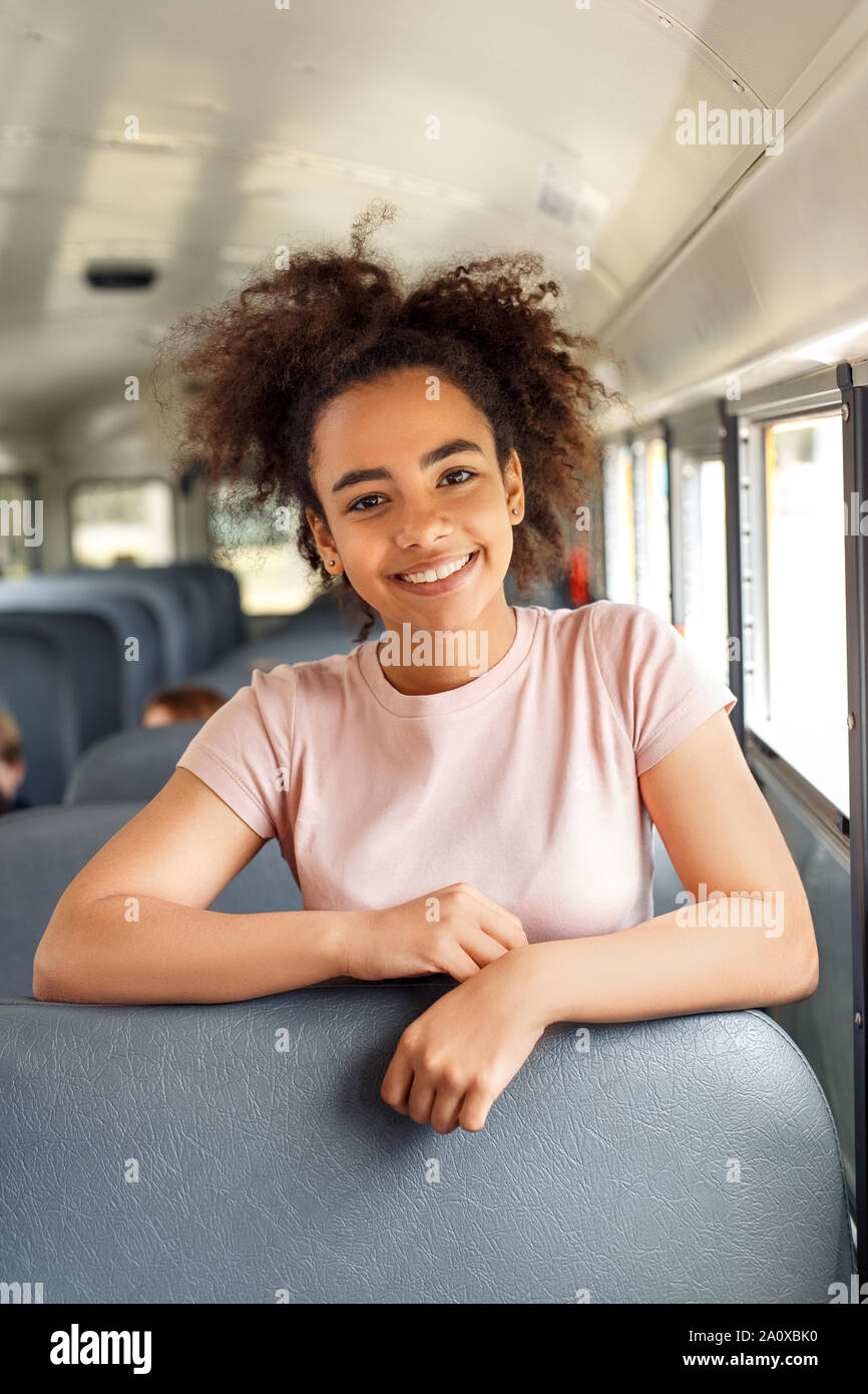 African girl sitting inside the school bus posing smiling toothy Stock ...