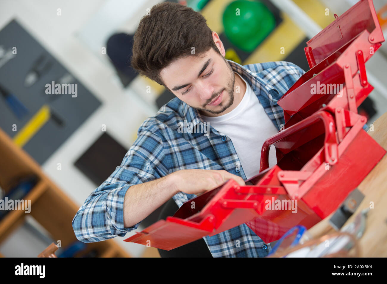 young man worker with toolbox Stock Photo - Alamy