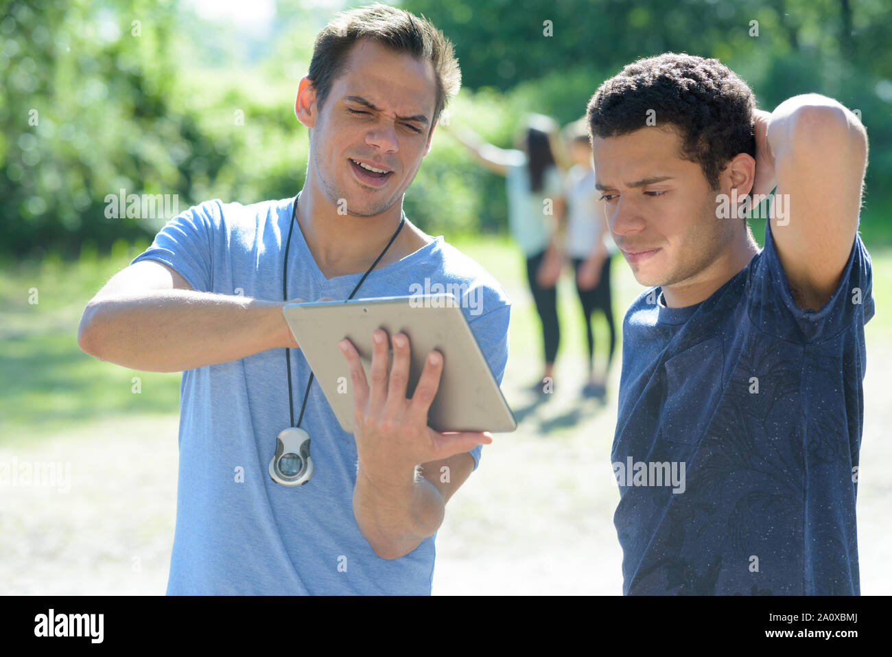 Fit trainer showing stopwatch hi-res stock photography and images - Alamy