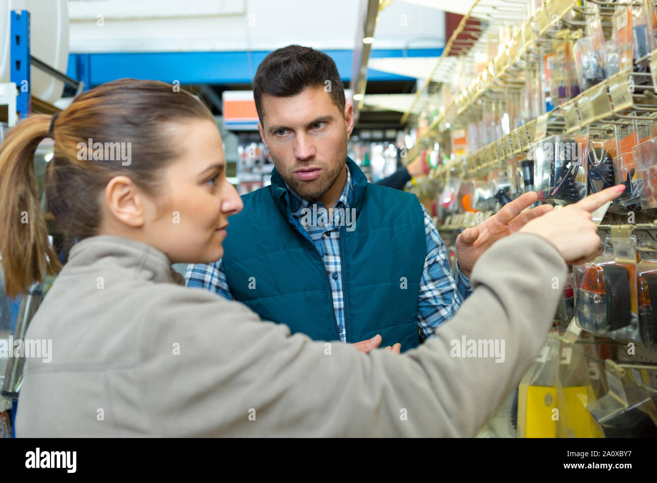 clerk advising customer in hardware store Stock Photo - Alamy
