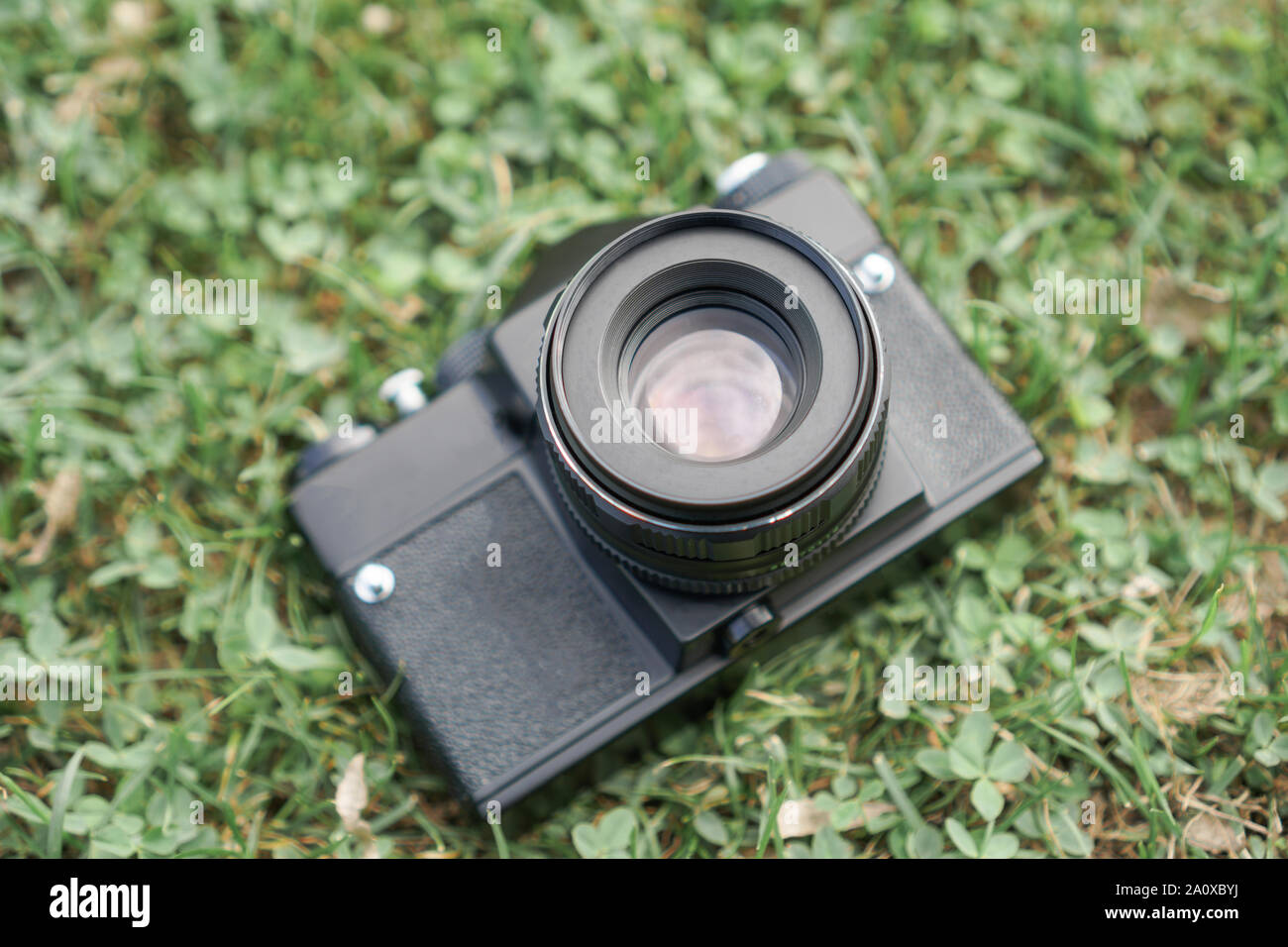 Ancient film camera on green grass. Travel concept and memorable photos ...