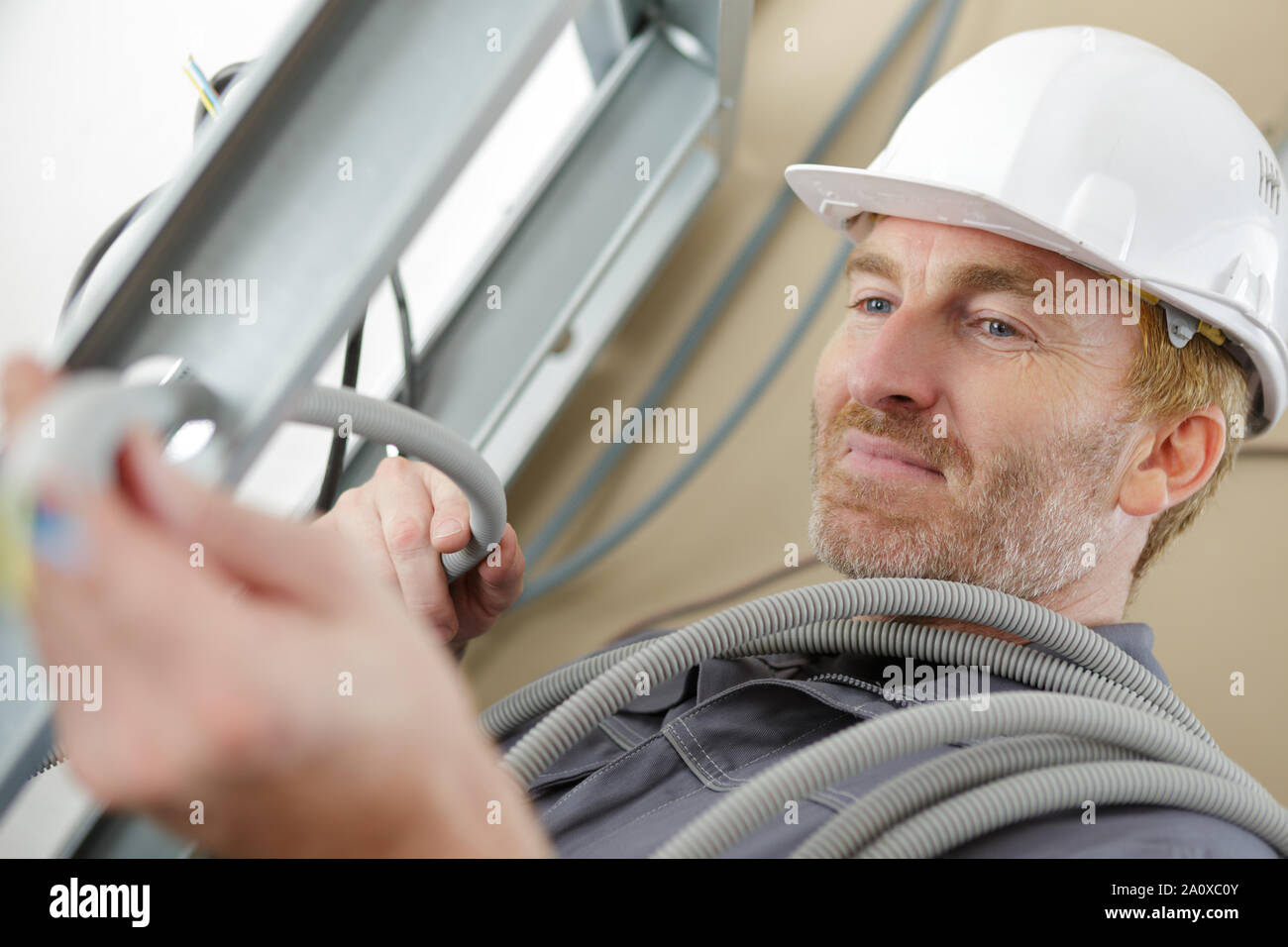 Men builder fixing pipe hi-res stock photography and images - Alamy