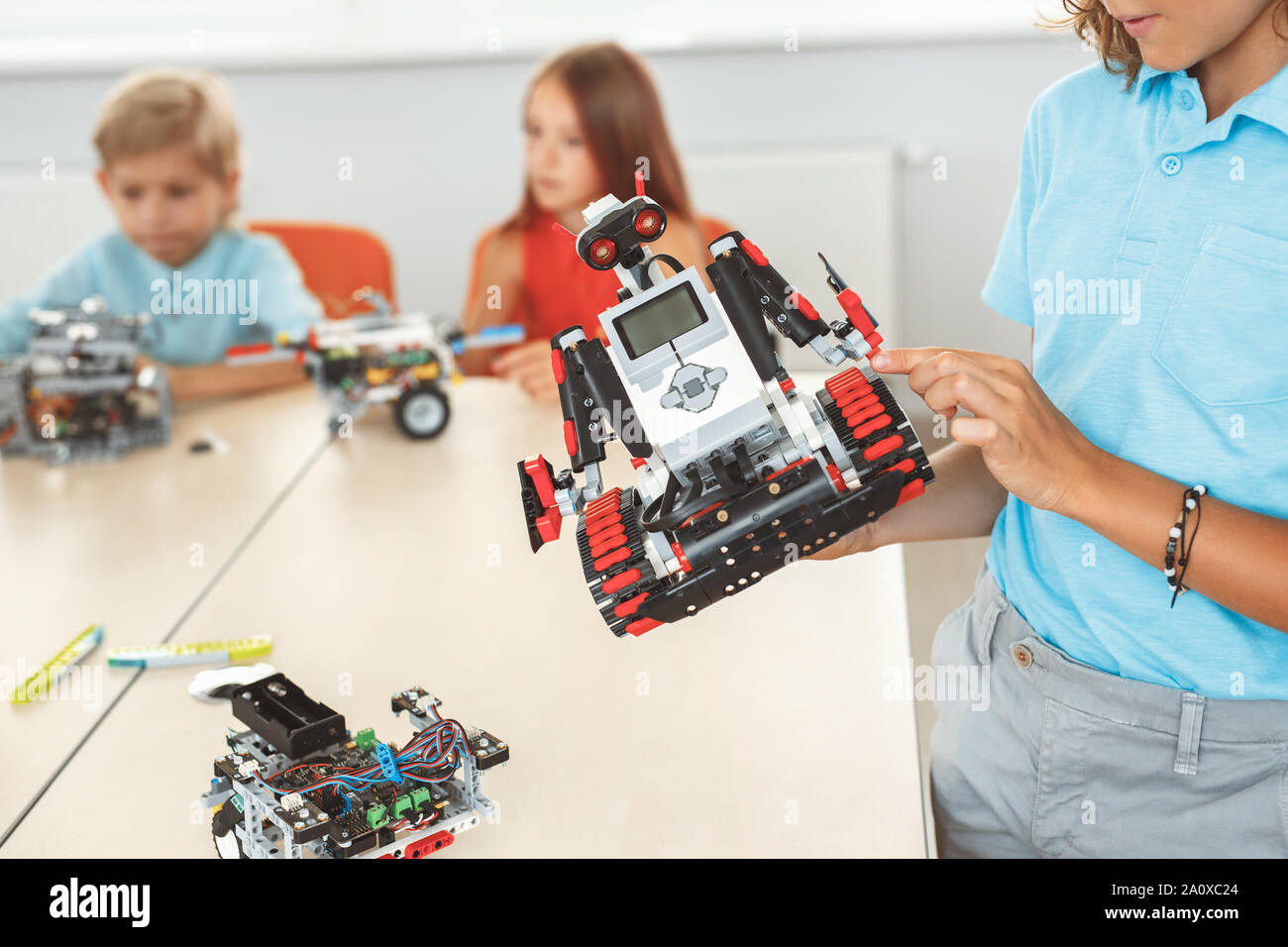 Robotics. Children having class sitting learning girl close-up with ...