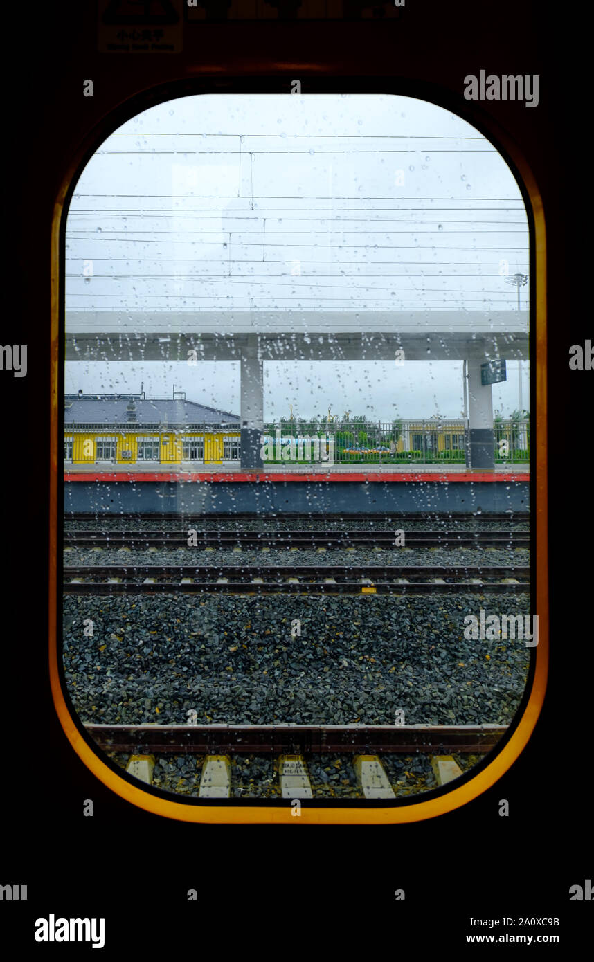 View from high speed train window in motion of countryside and sky ...
