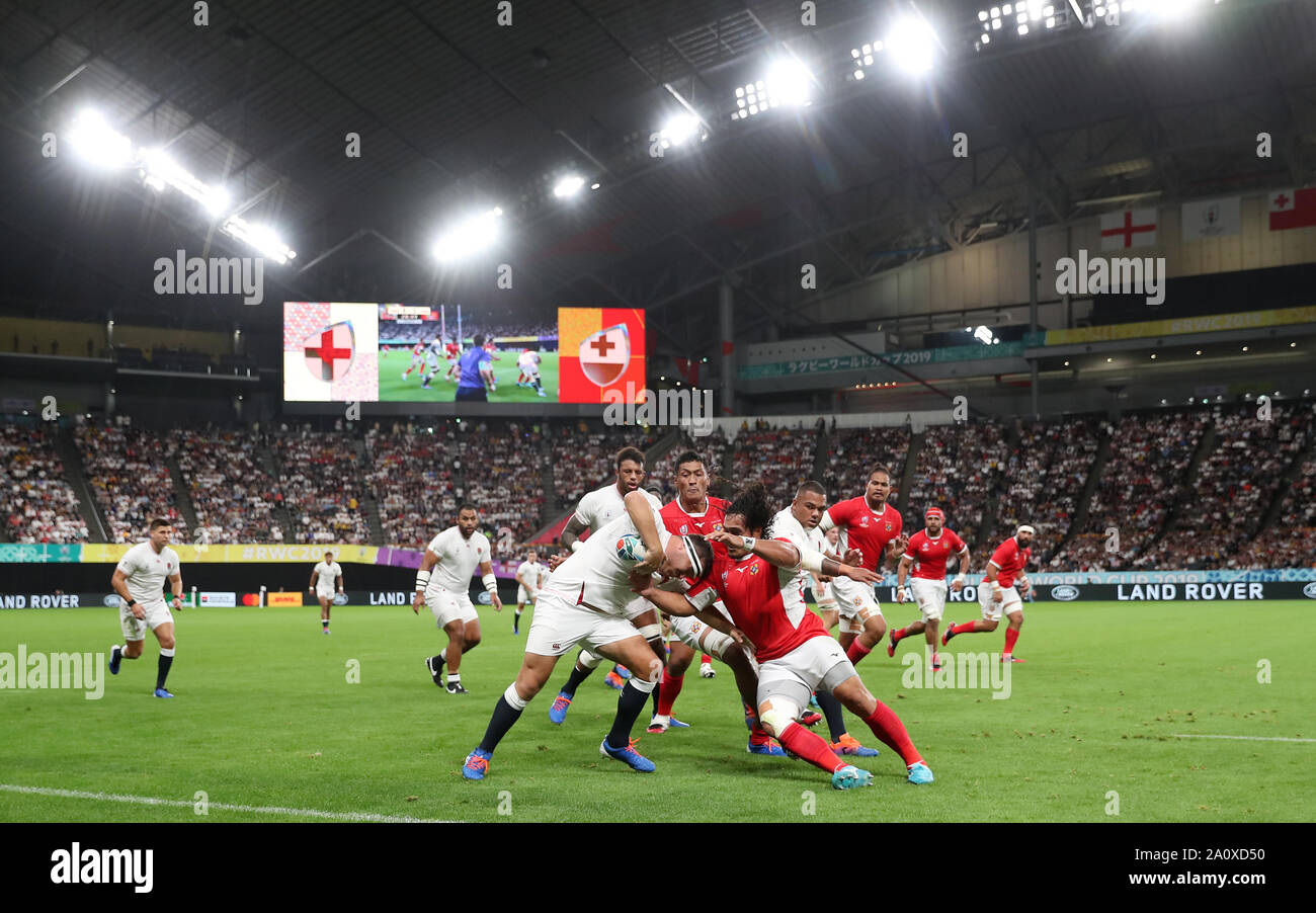 England's Jamie George is tackled by Tonga's Sosefo Sakalia during the ...