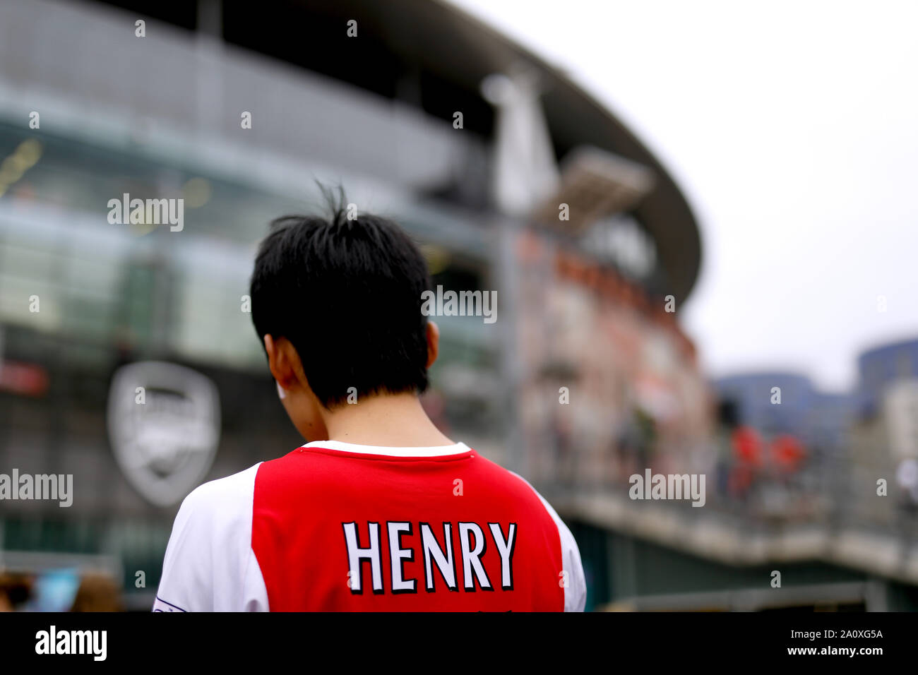 An Arsenal fan arrives at the stadium ahead of the Premier League match ...