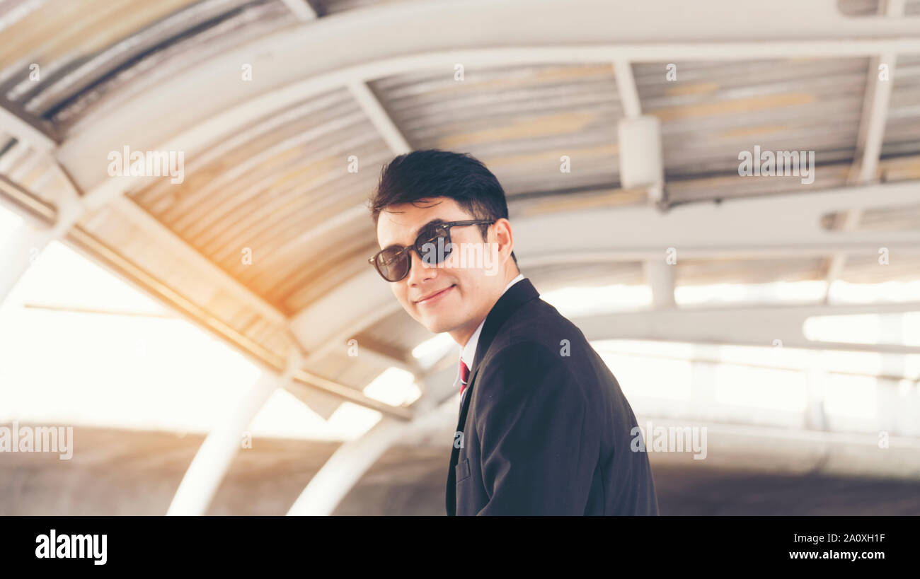 Leader young executive businessman standing in modern city background ...