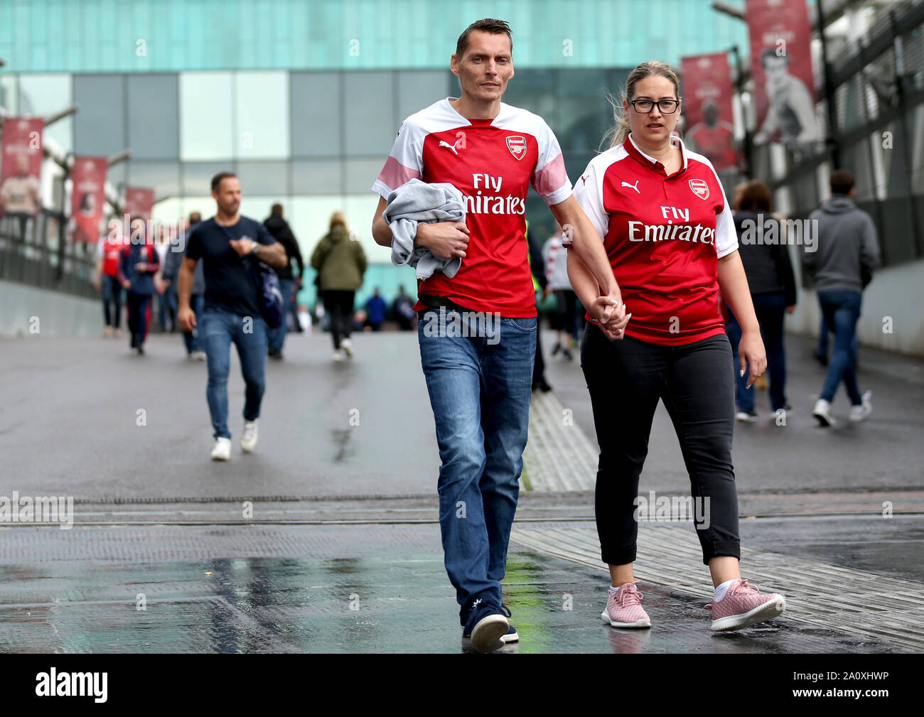 Arsenal fans arrive at the stadium ahead of the Premier League match at ...