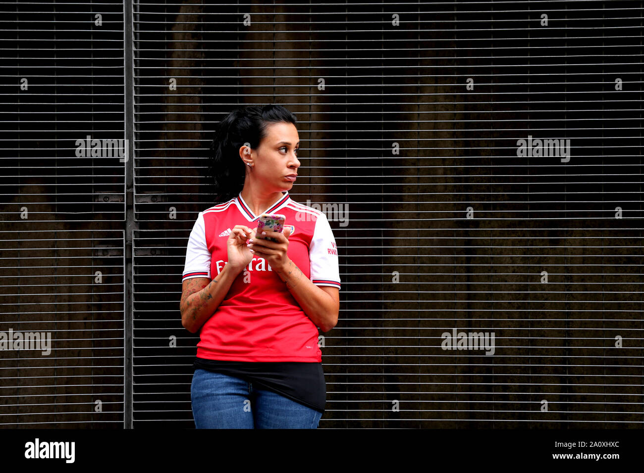 An Arsenal fan outside the stadium ahead of the Premier League match at ...