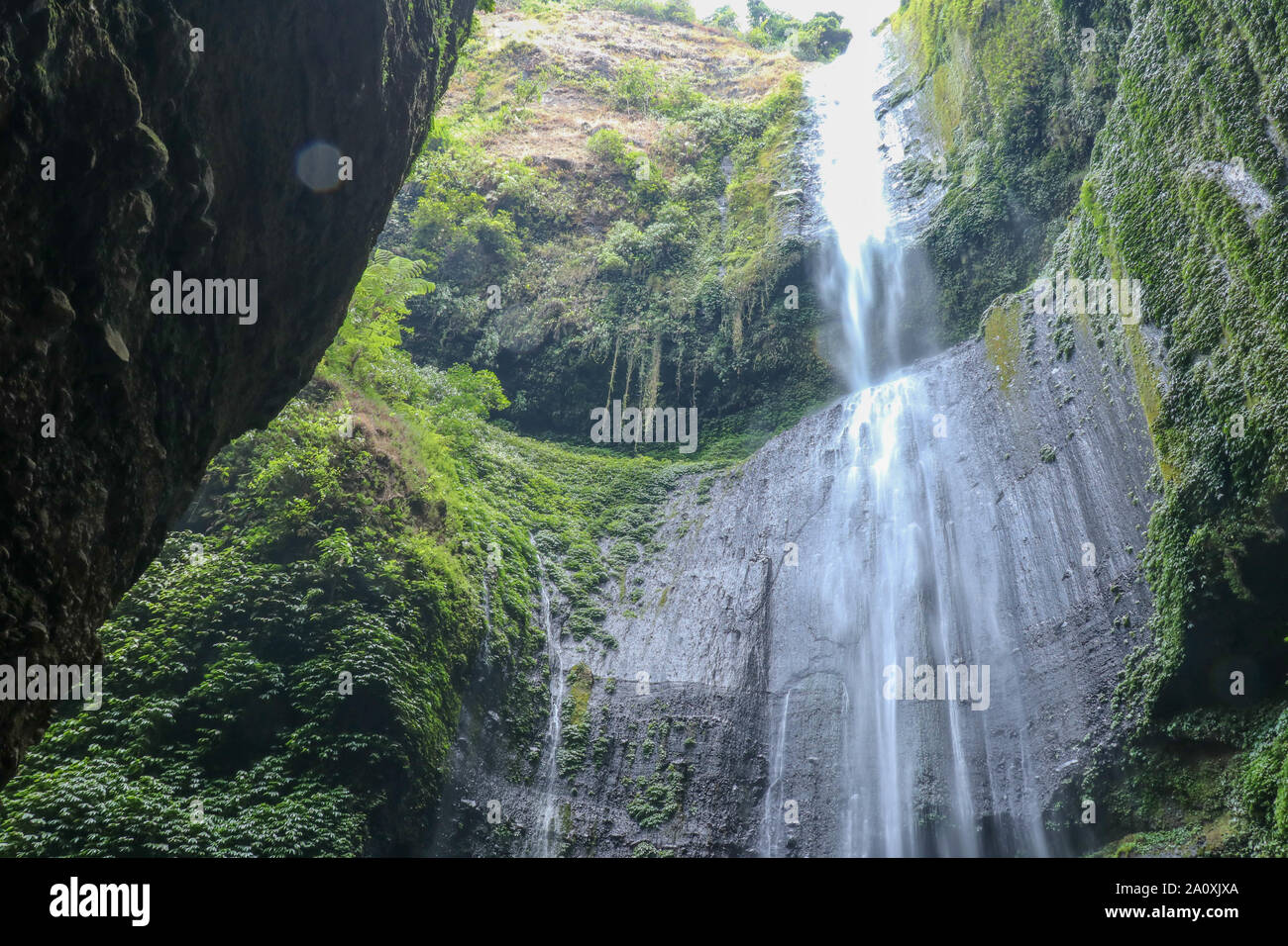 200 meters high Madakaripura waterfall in deep rocky canyon on Java ...
