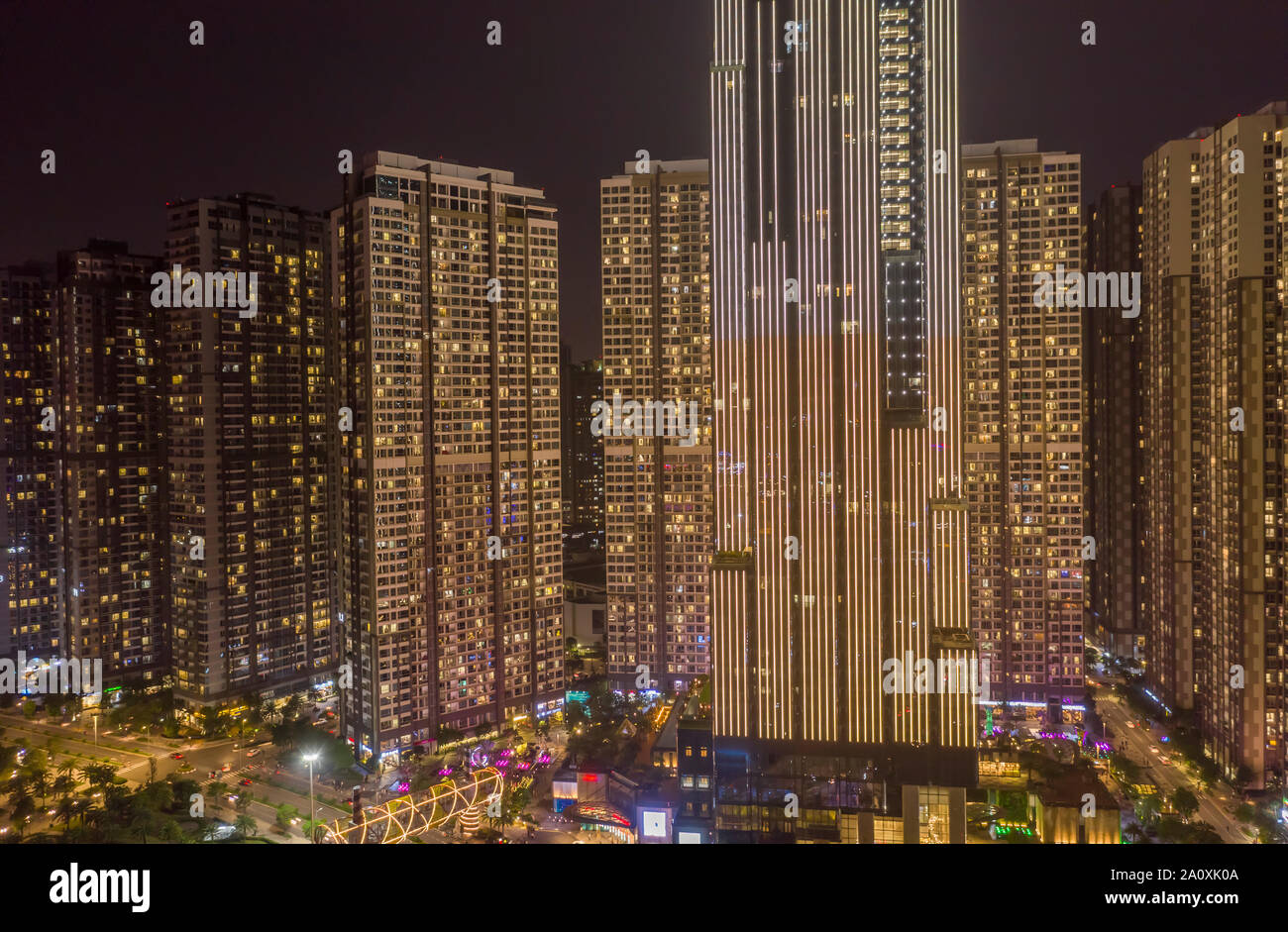 Massive Modern High Density High Rise Buildings at night under lights ...