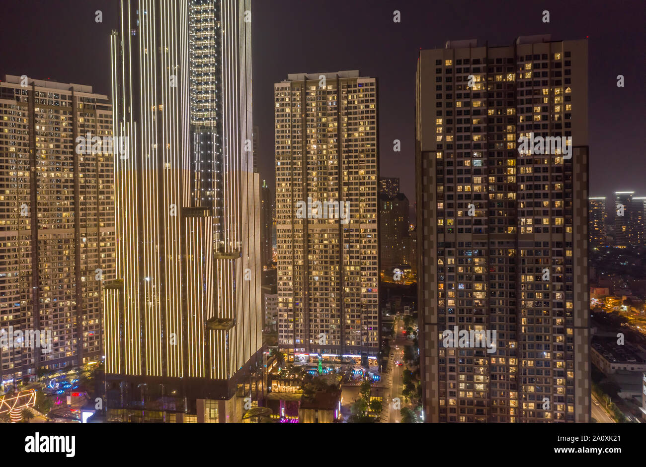 Massive Modern High Density High Rise Buildings at night under lights ...
