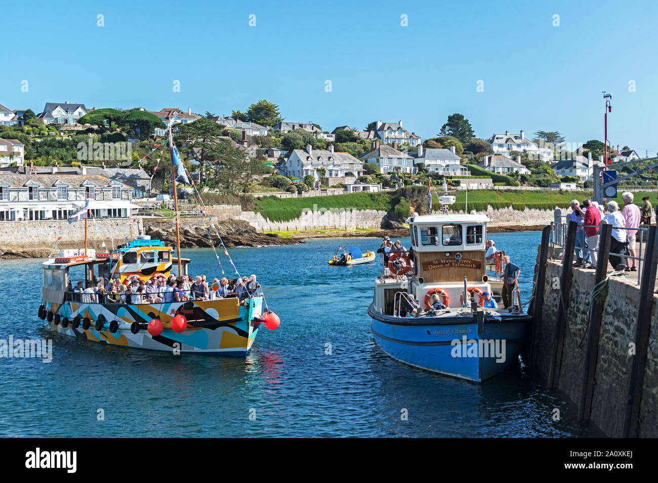 the st.mawes ferry coming in to the harbour after the short journey ...