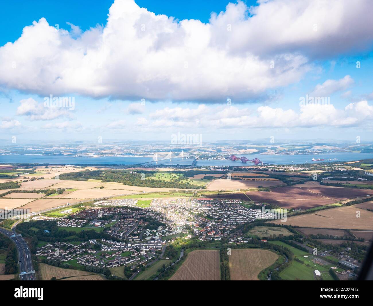 View from plane window of three bridges across Firth of Forth, Scotland ...