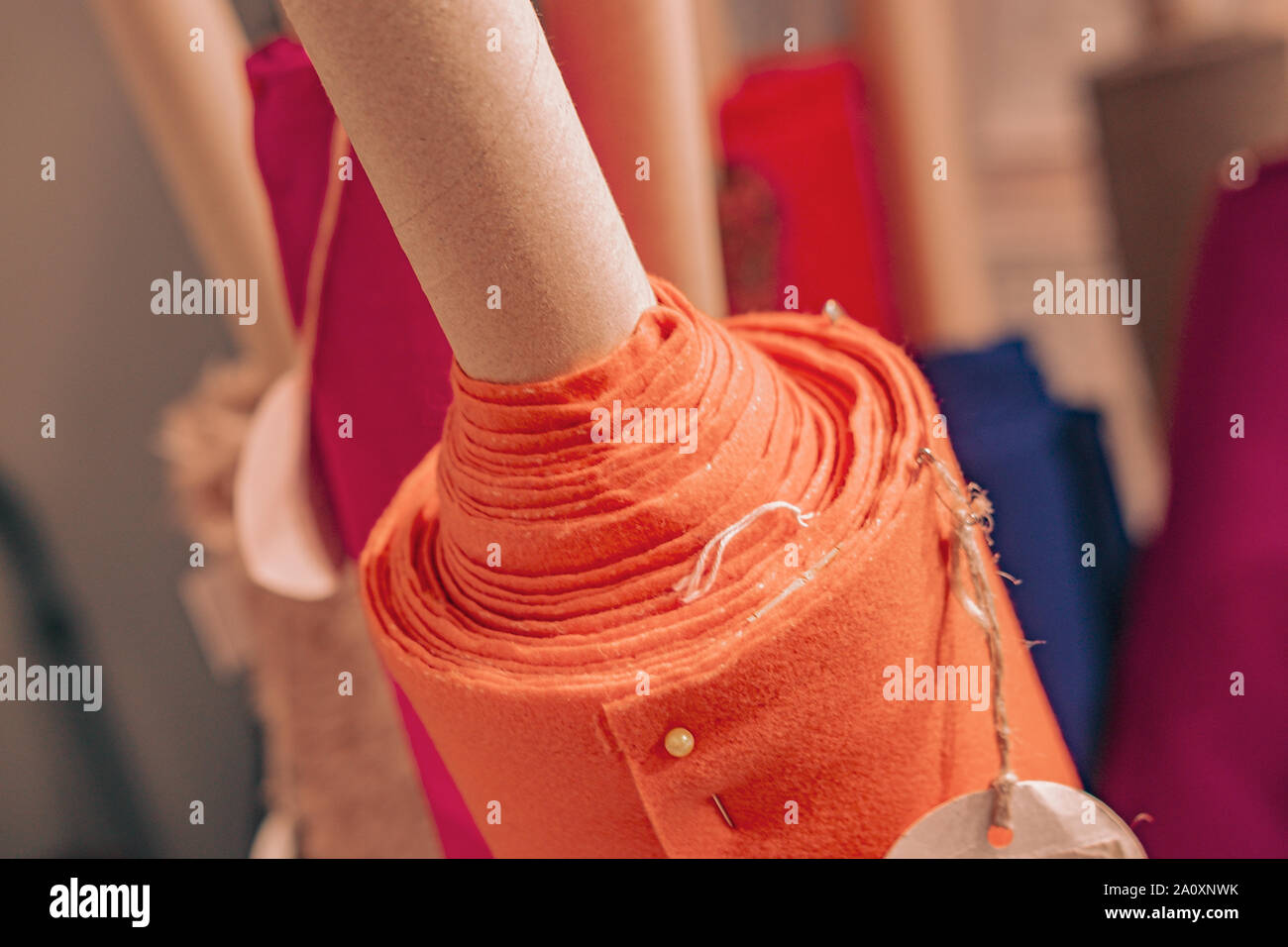 Rolls of natural high fashion fabrics and textiles. Sewing industry ...