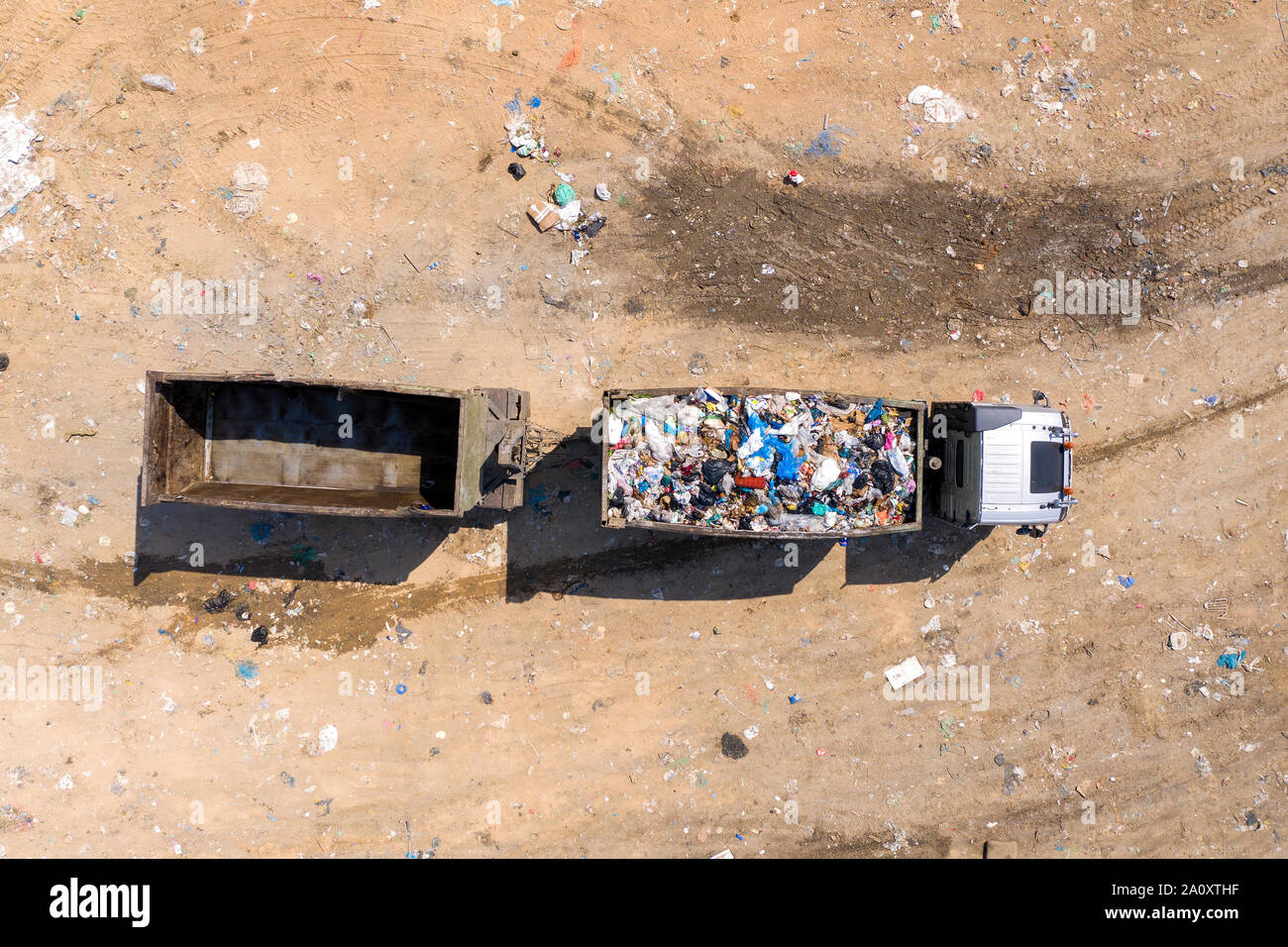 Loaded Garbage Trucks unloading at a Municipal landfill, Top down ...