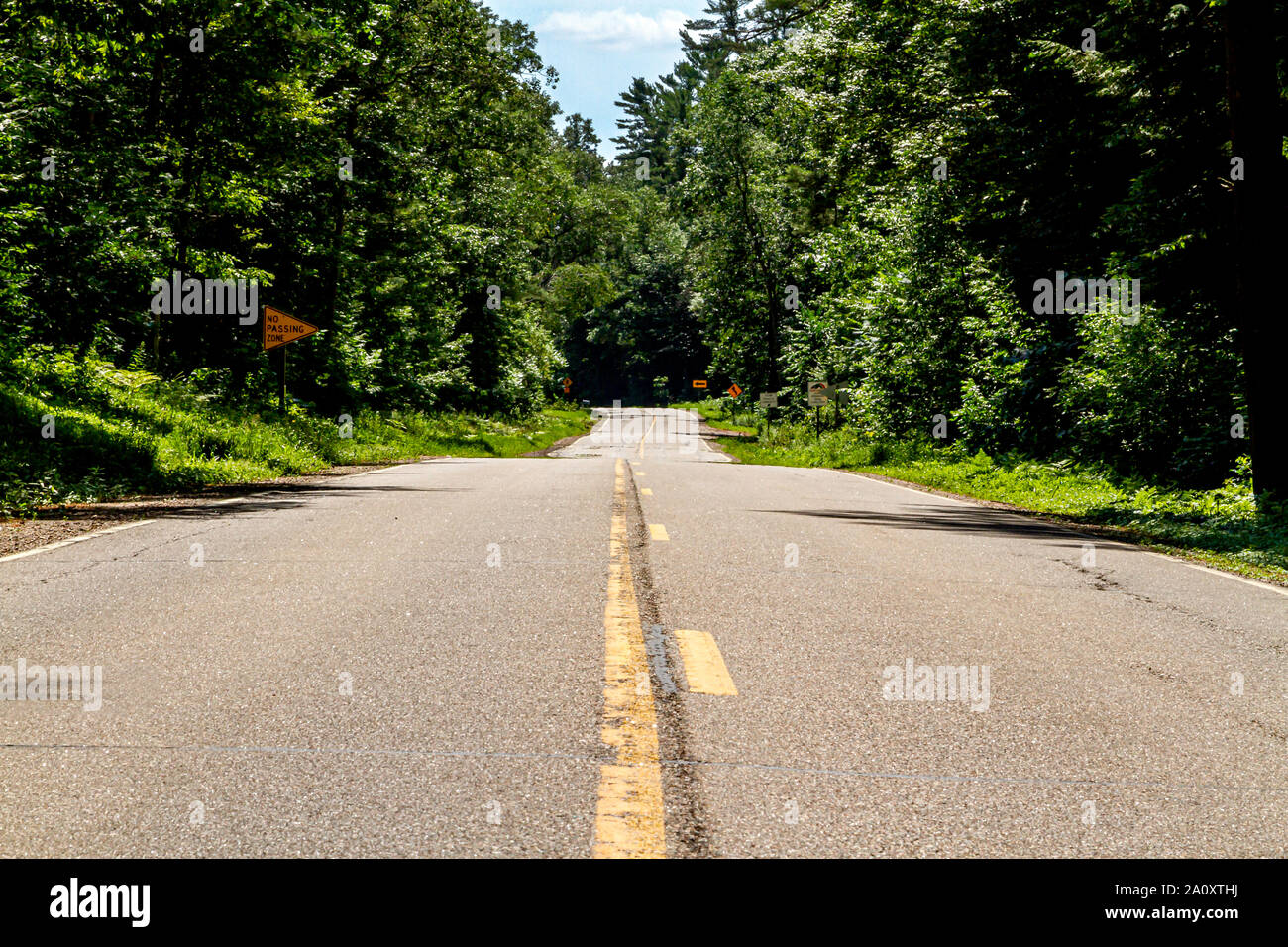 Looking down the centerline of an empty country road Stock Photo - Alamy