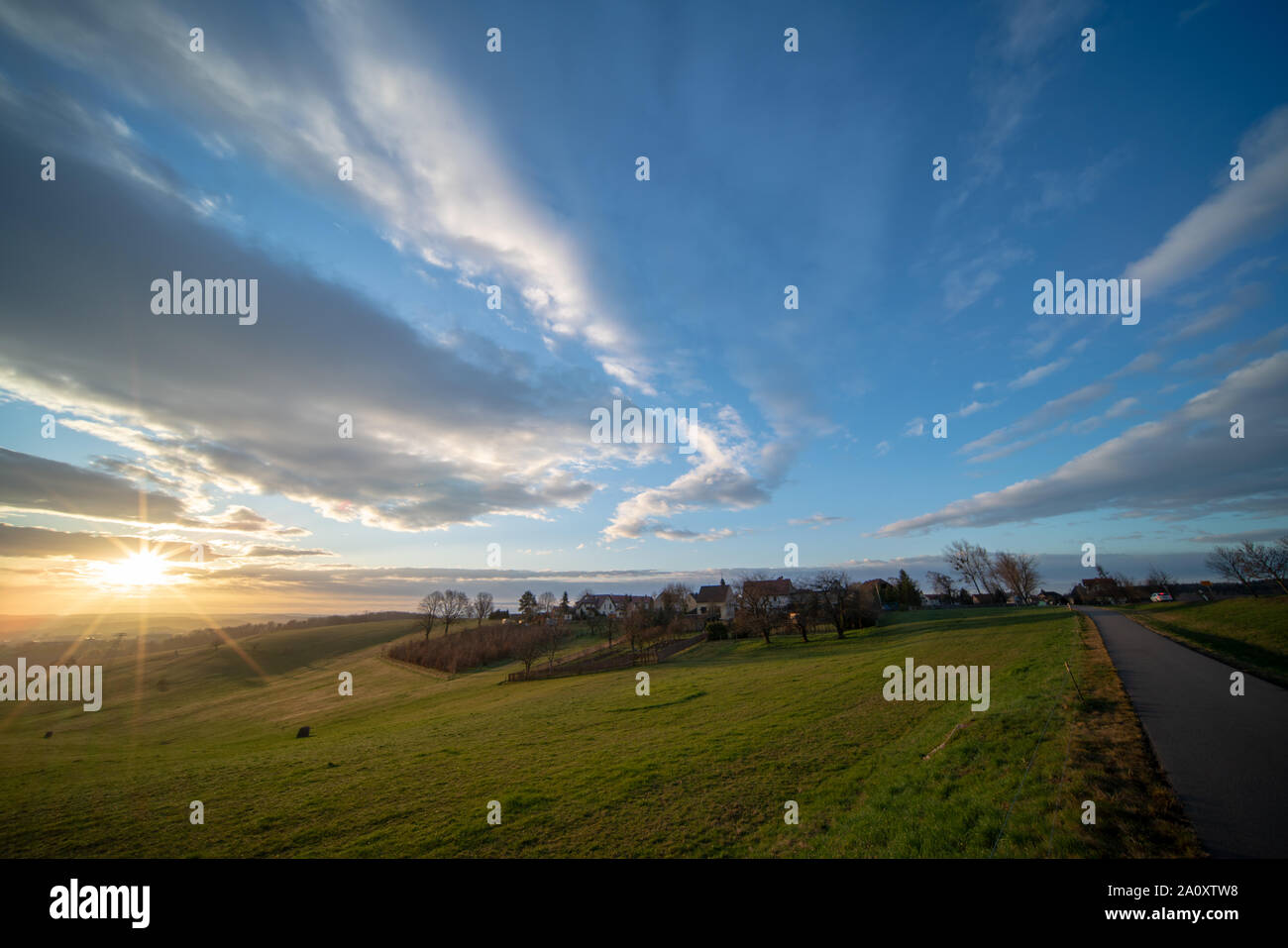 Sunrise in spring field at early morning Stock Photo - Alamy
