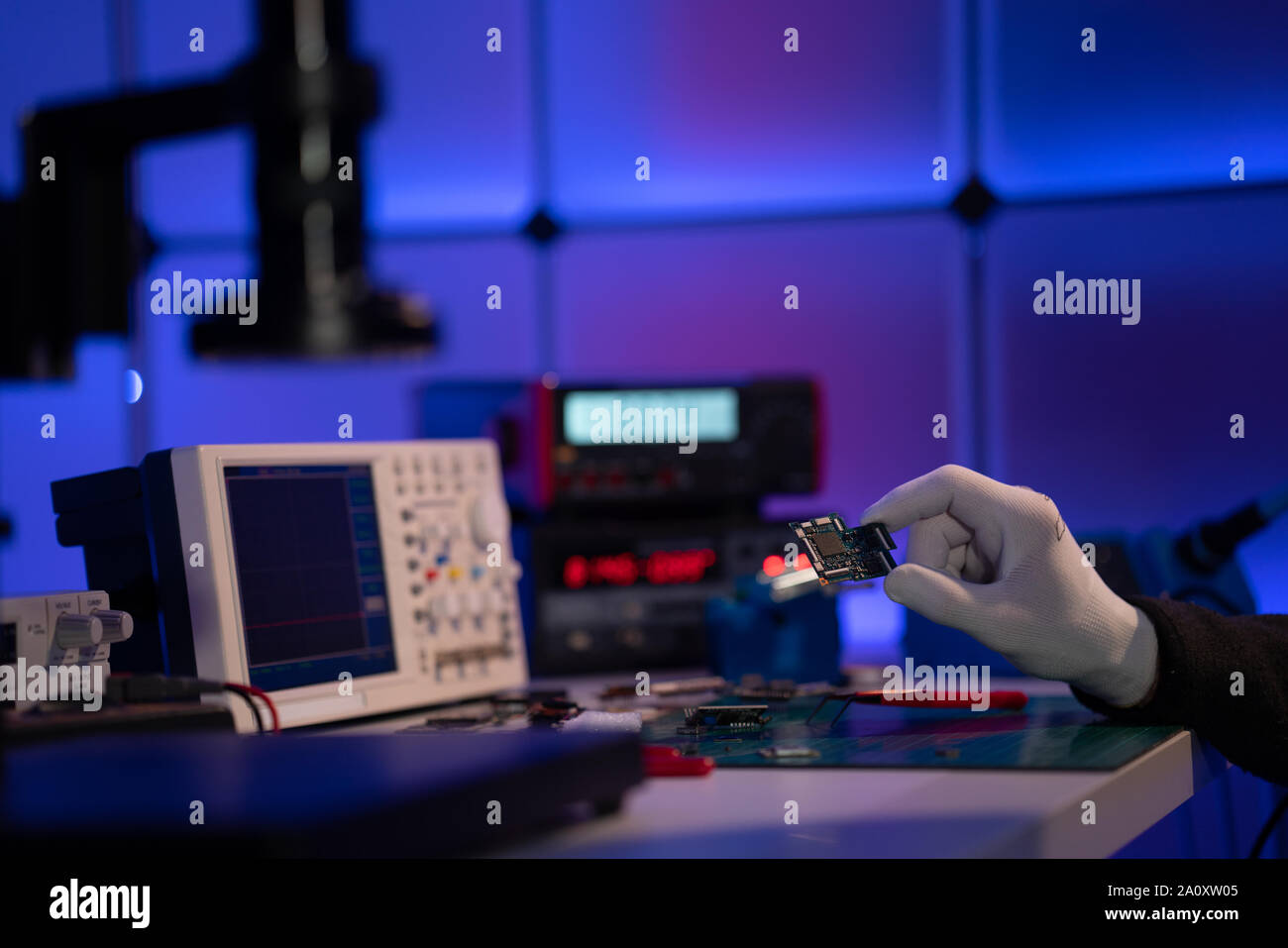 Check electronics device in industrial lab Stock Photo - Alamy