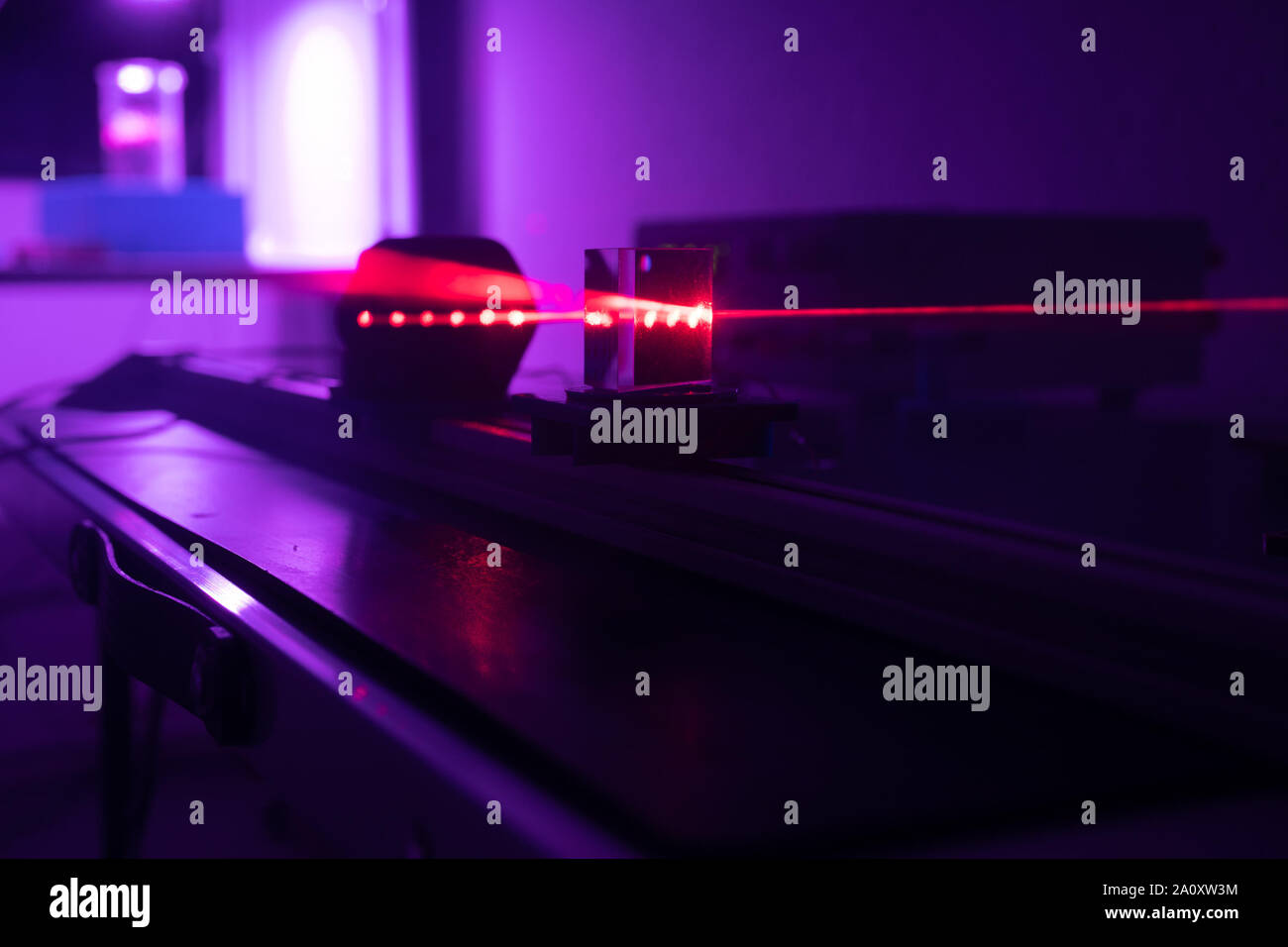 Experiment with red laser in optics lab Stock Photo - Alamy