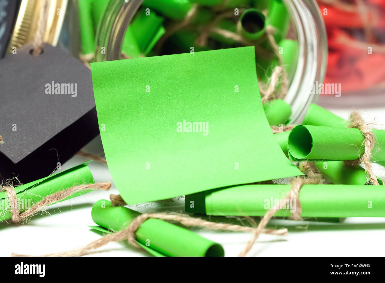 Blank green sheet of paper and a lot of green paper scrolls. Background ...