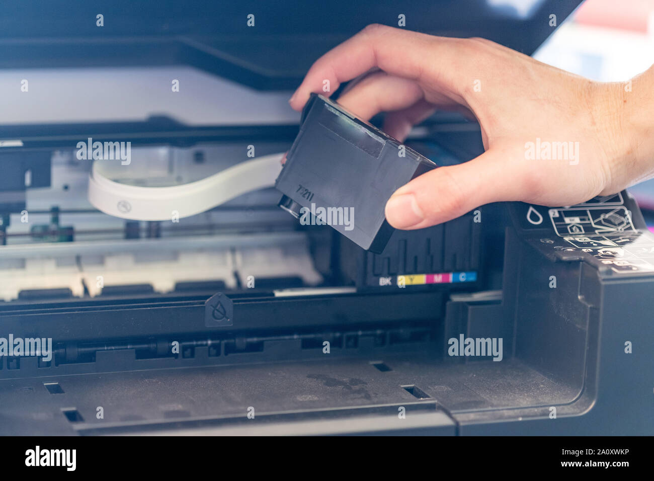 Putting new printer cartridge into the printer, inkjet Stock Photo - Alamy