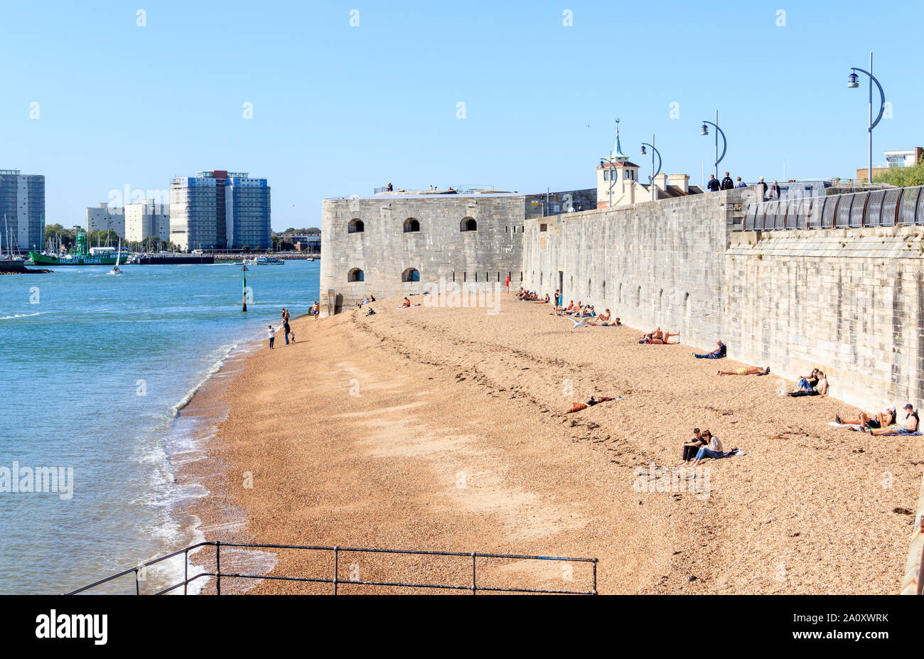 People sunning themselves on the beach at Portsmouth harbour, the Round ...