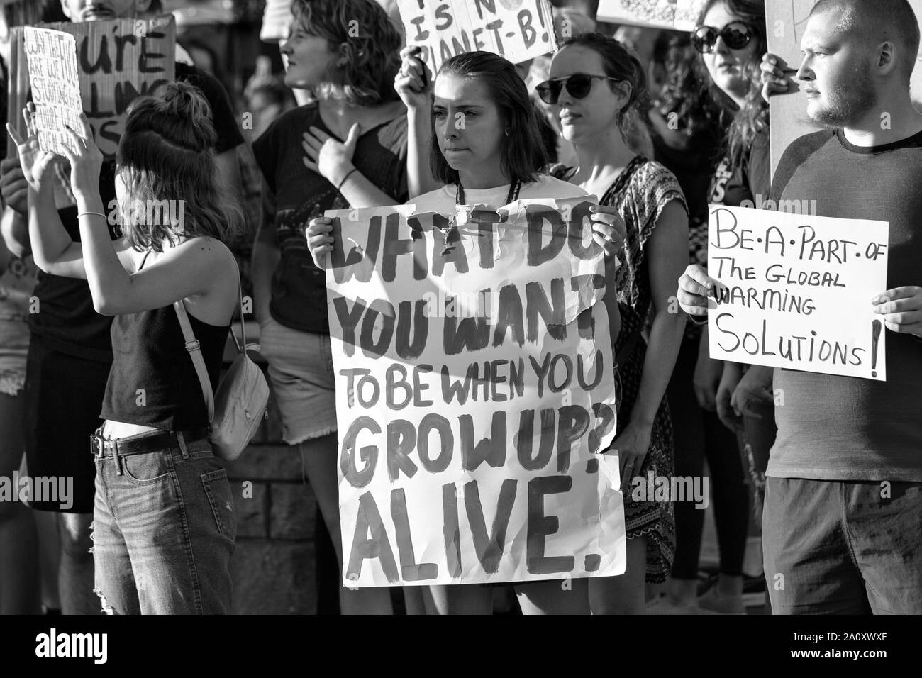 Gen Z protesters hold signs at the International Justice Rally in ...