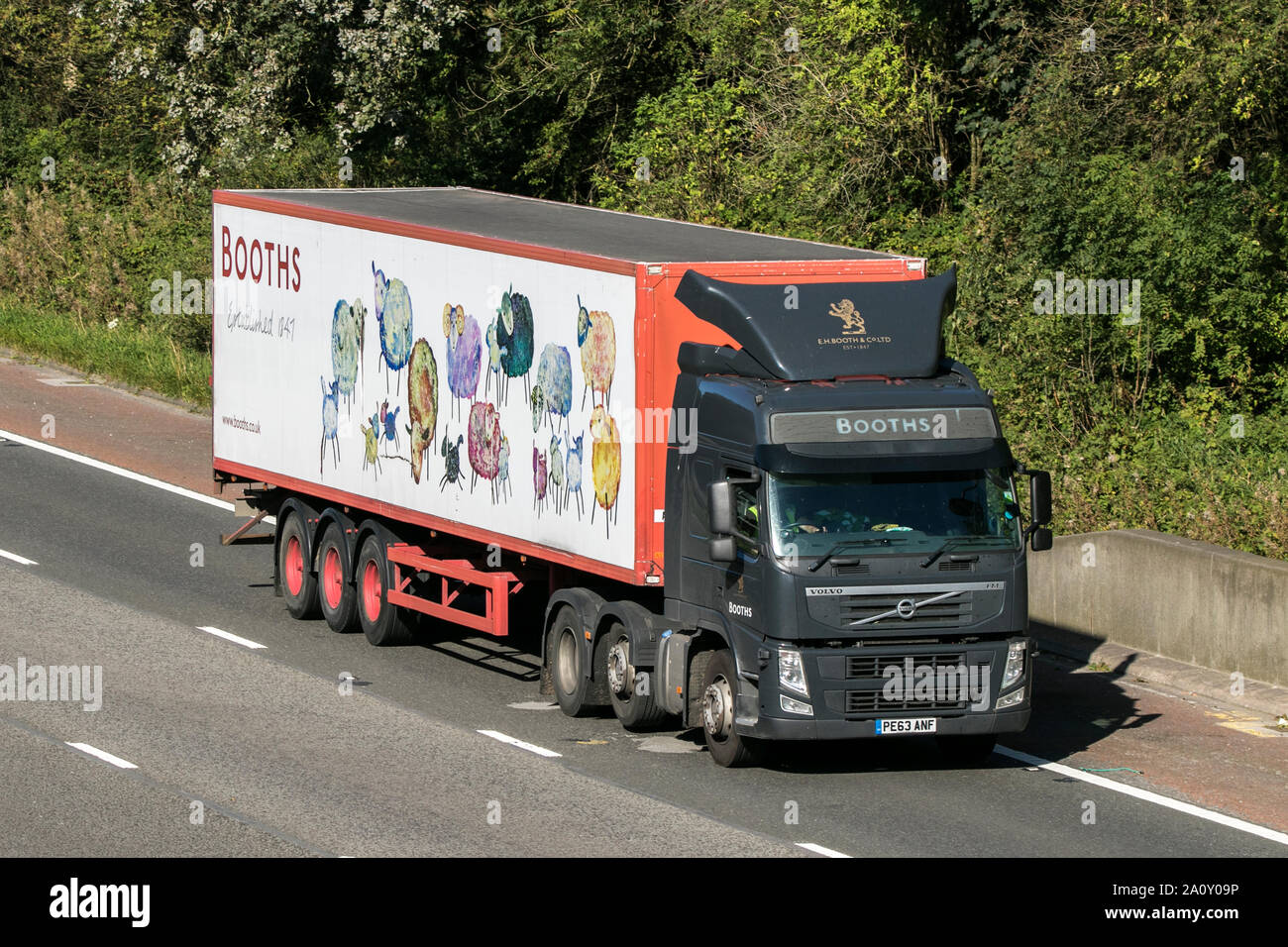 A Booths grocer Volvo cargo freight truck travelling northbound on the ...