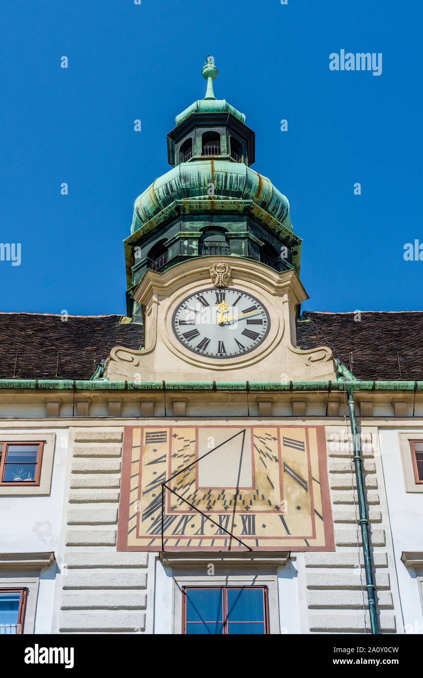 Clock and sundial in the Hofburg Palace inner courtyard, Vienna ...