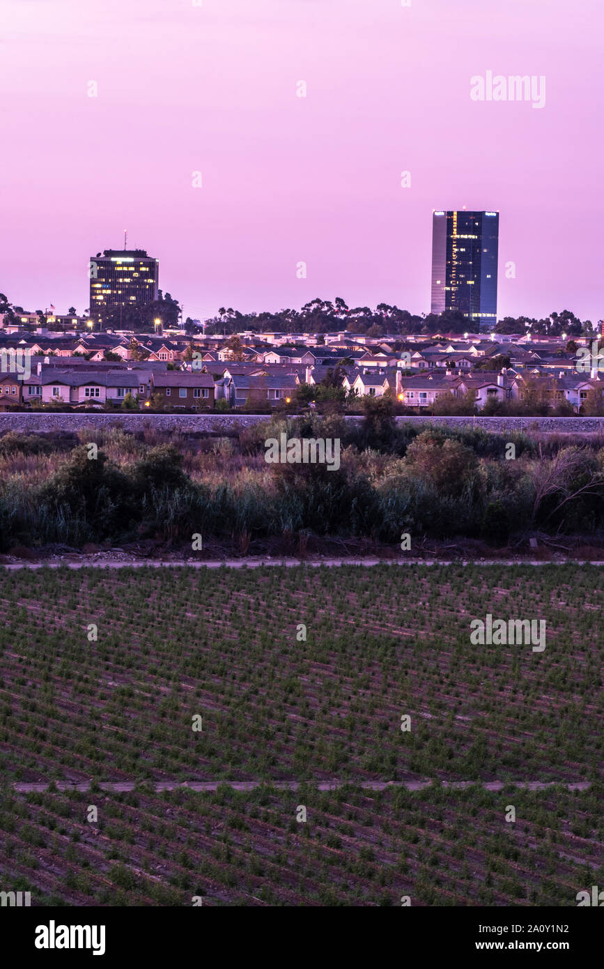 Lamp illuminate twin financial towers of Oxnard as city skyline borders ...