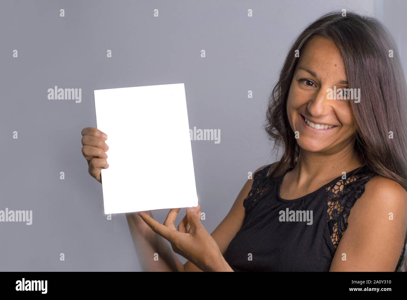 Young woman reading a book with concentrated and happy attitude Stock ...