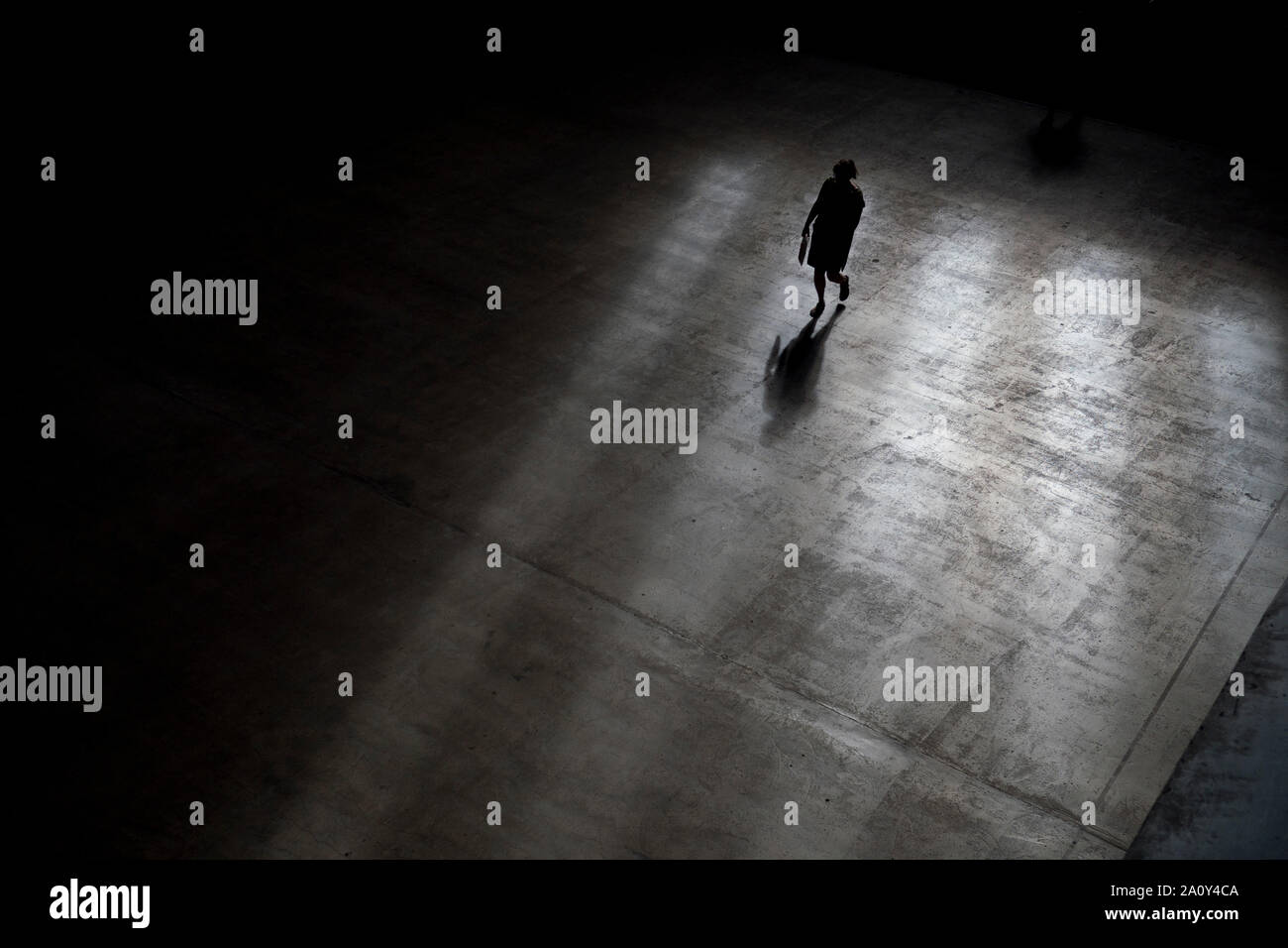 Walking in shadow Stock Photo - Alamy