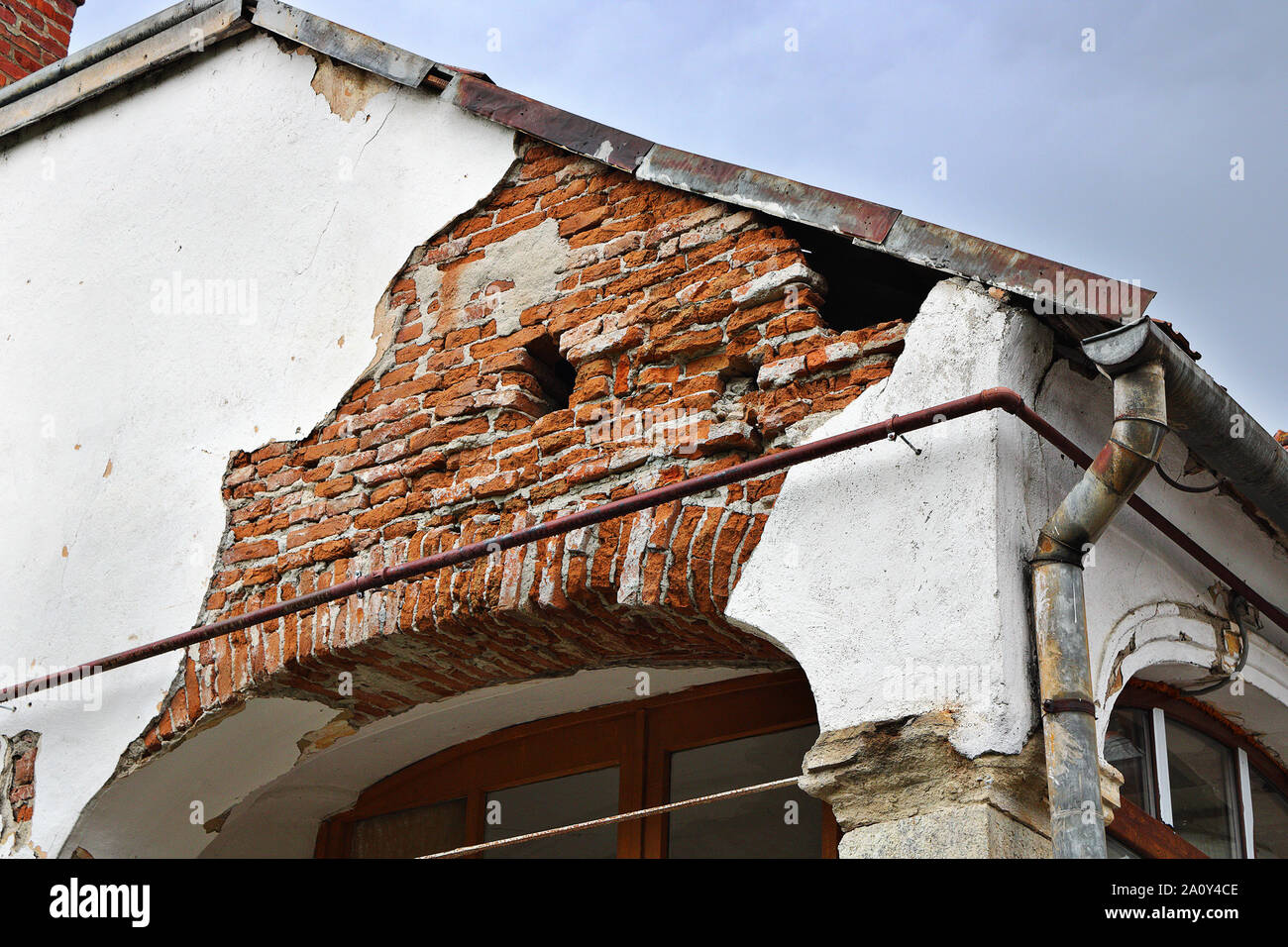 damaged plaster layer on old house; effects of rain water leakage from ...