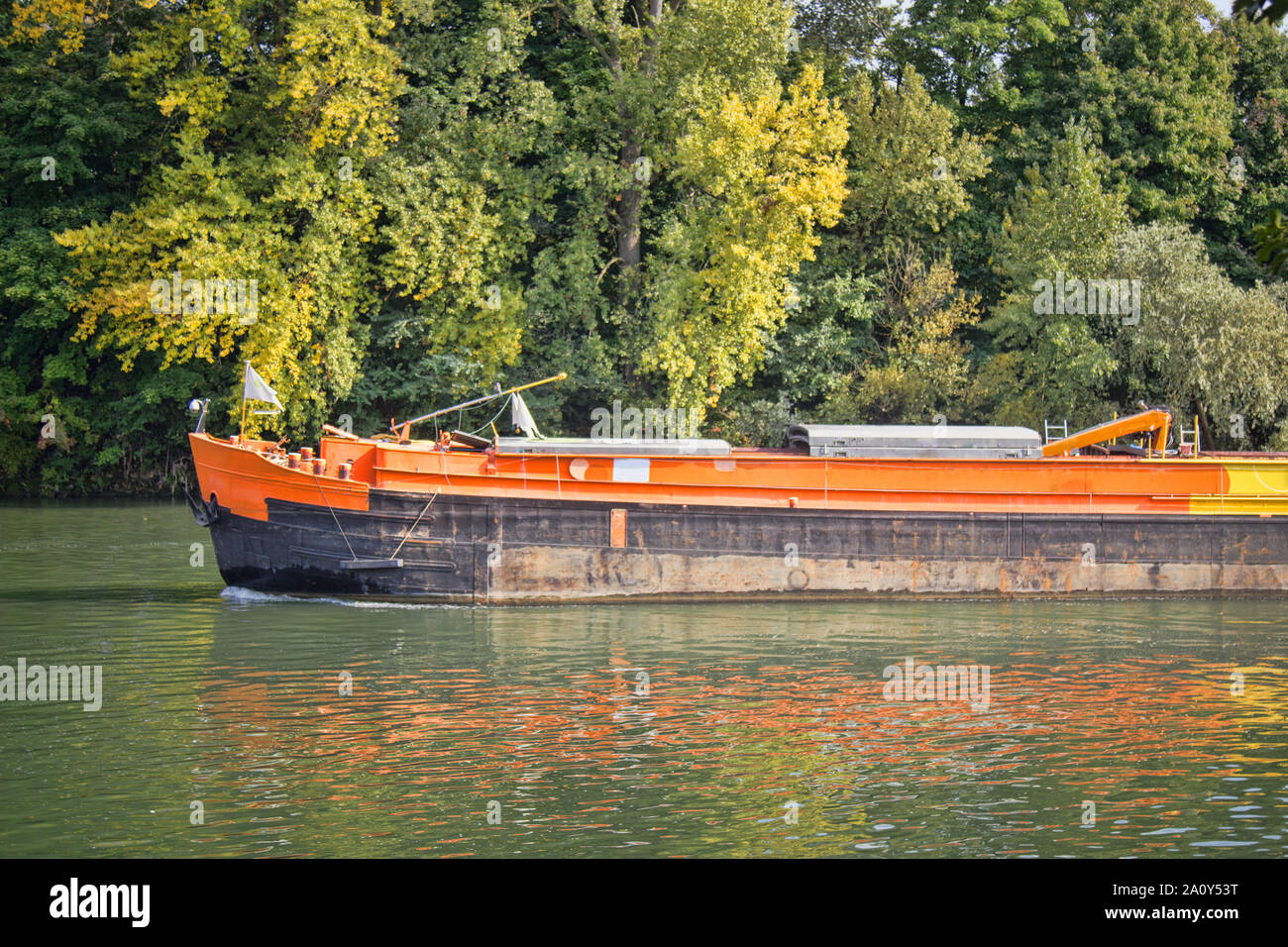 River navigation in France. Barge on Seine. cargo ships floating along ...